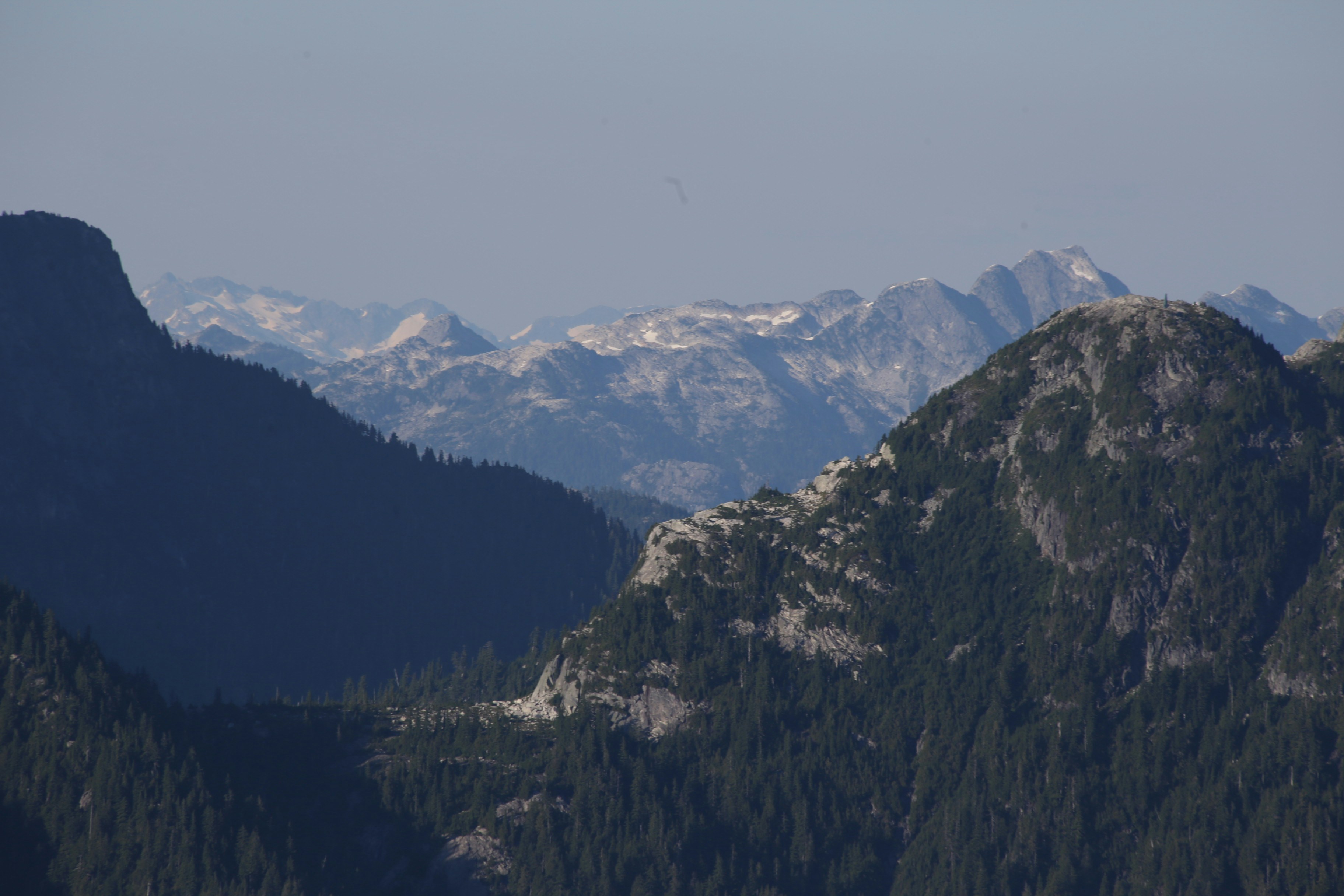 Mountain Ridge in Soft Backlit Valleys