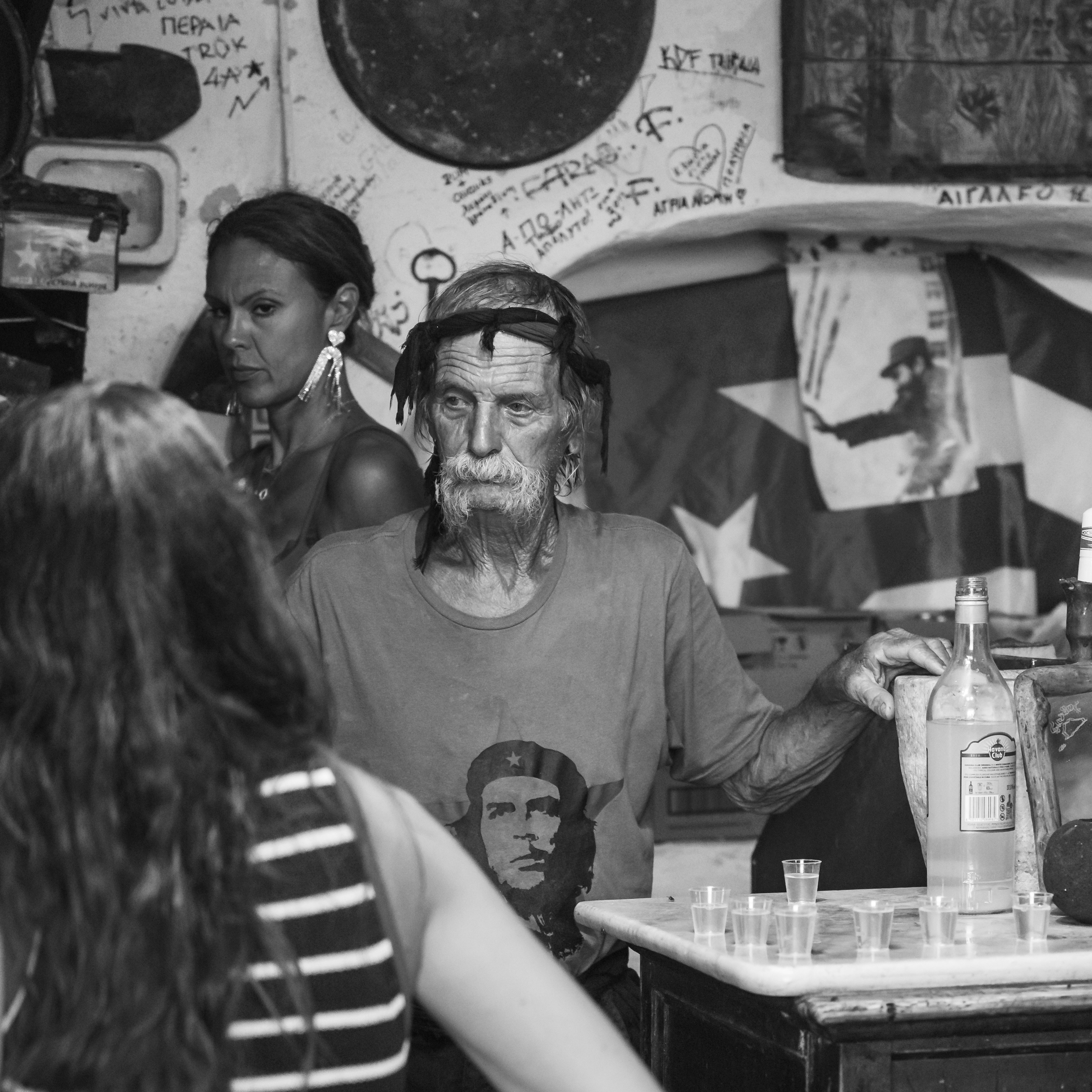 Grizzled Narrator at a Graffiti-Tiled Bar