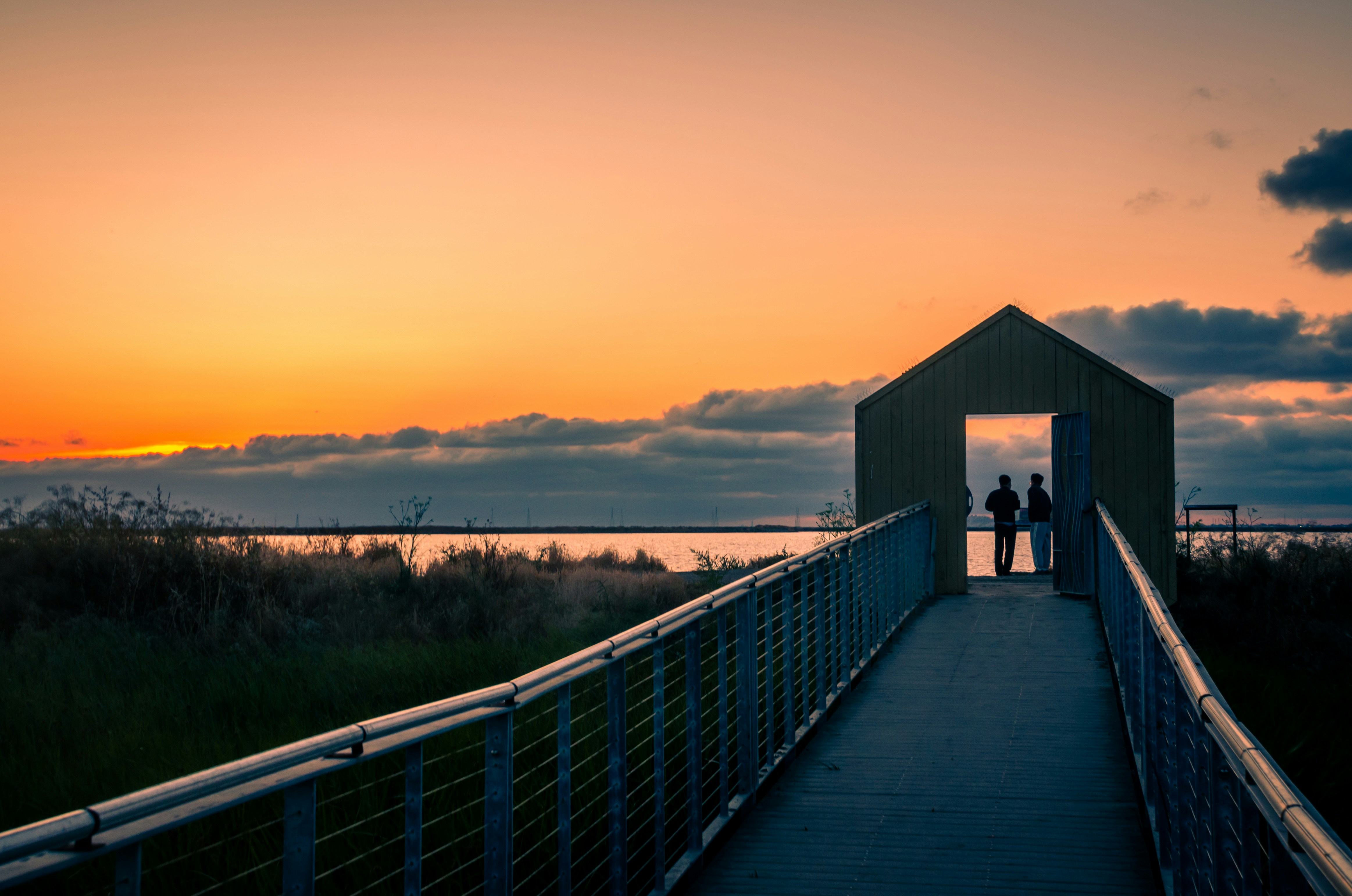 Sunset Walkway to the Silhouetted Friends