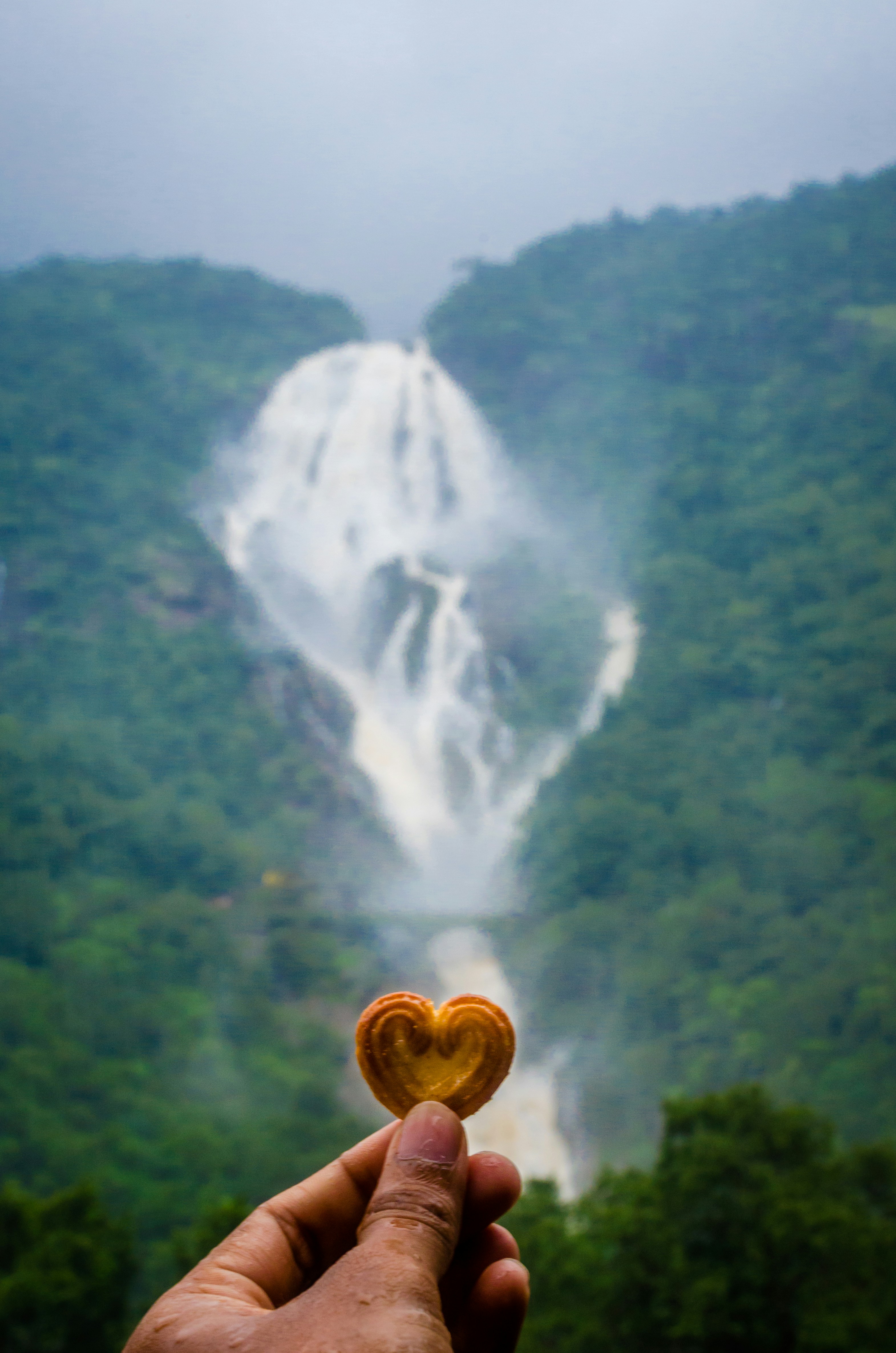 Golden Heart over a Cascade: Handheld Treasure Before the Falls