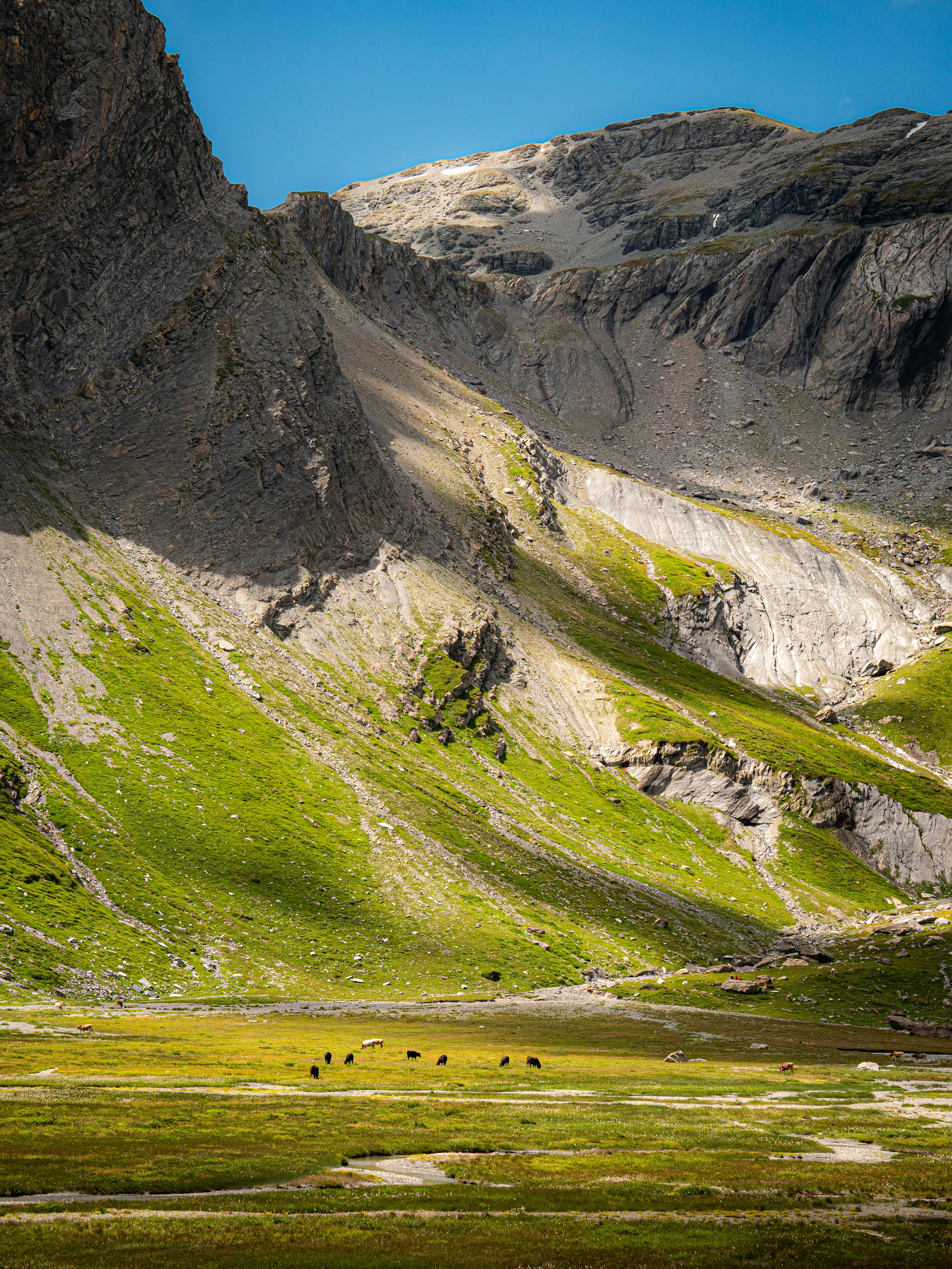 Rugged Alpine Tiers Under a Blue Sky