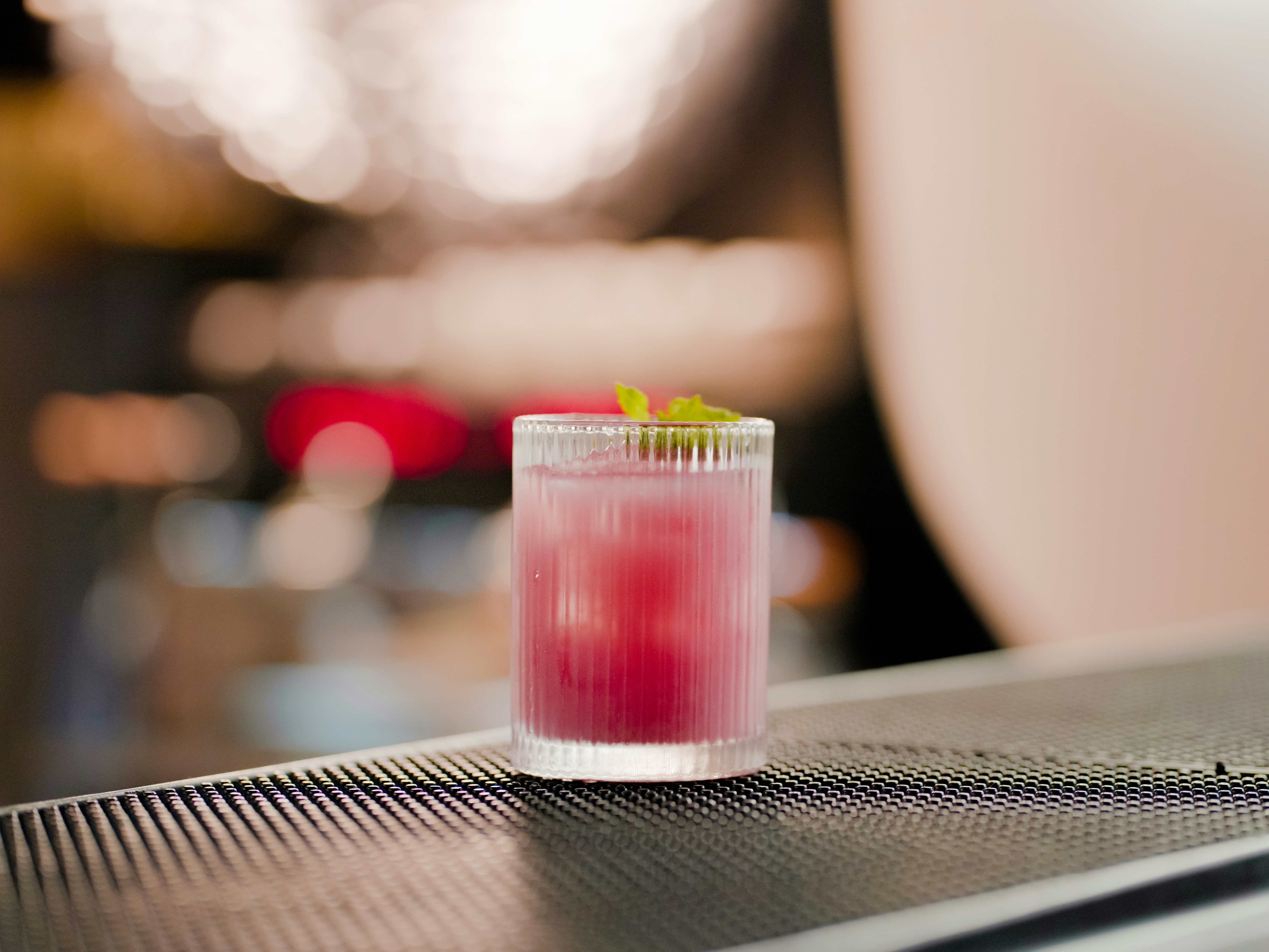 Crystalline Pink Cocktail Centered on a Bar Surface