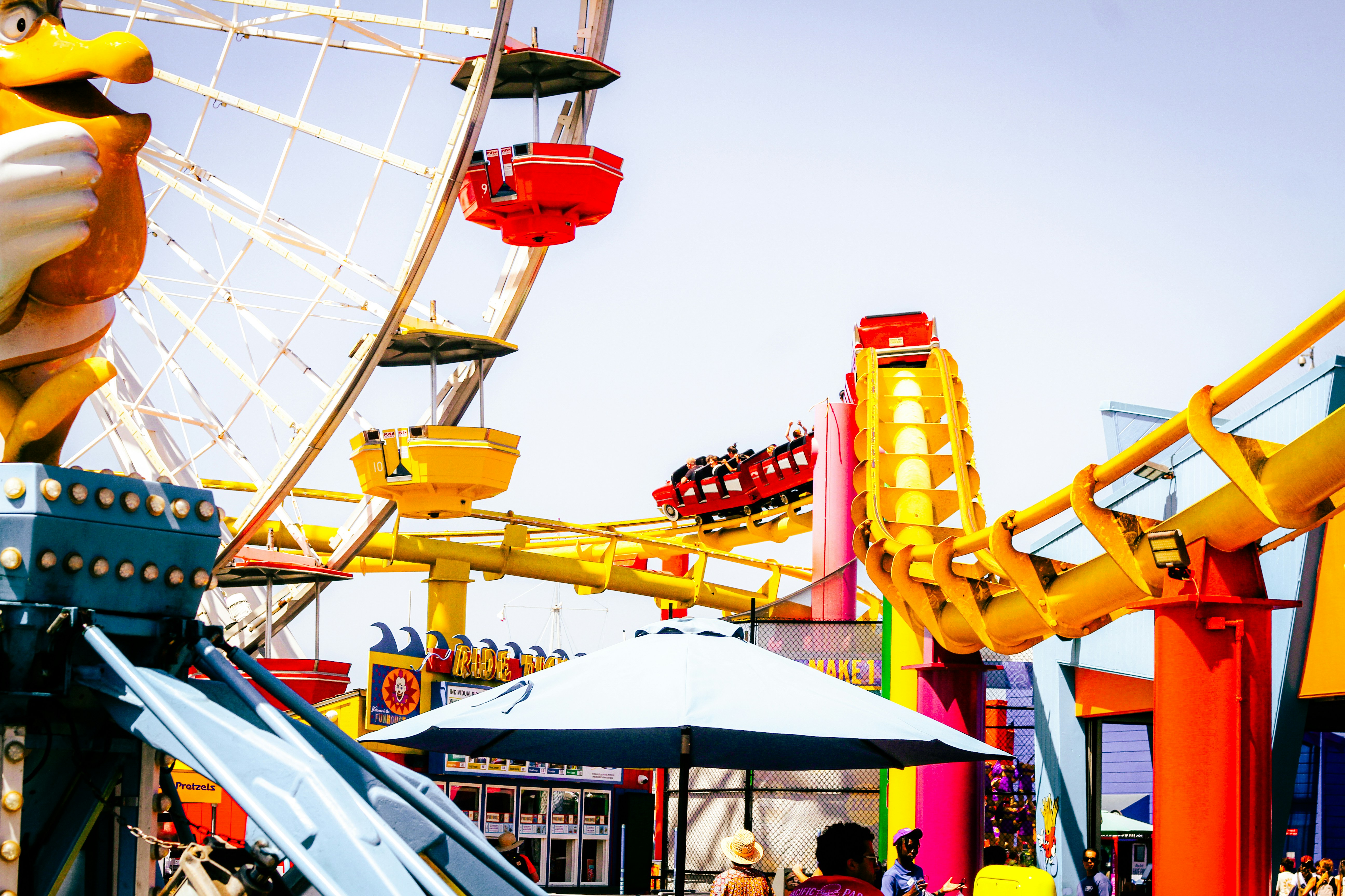 Colorful Coaster Chaos: A Sunlit Ride in Motion