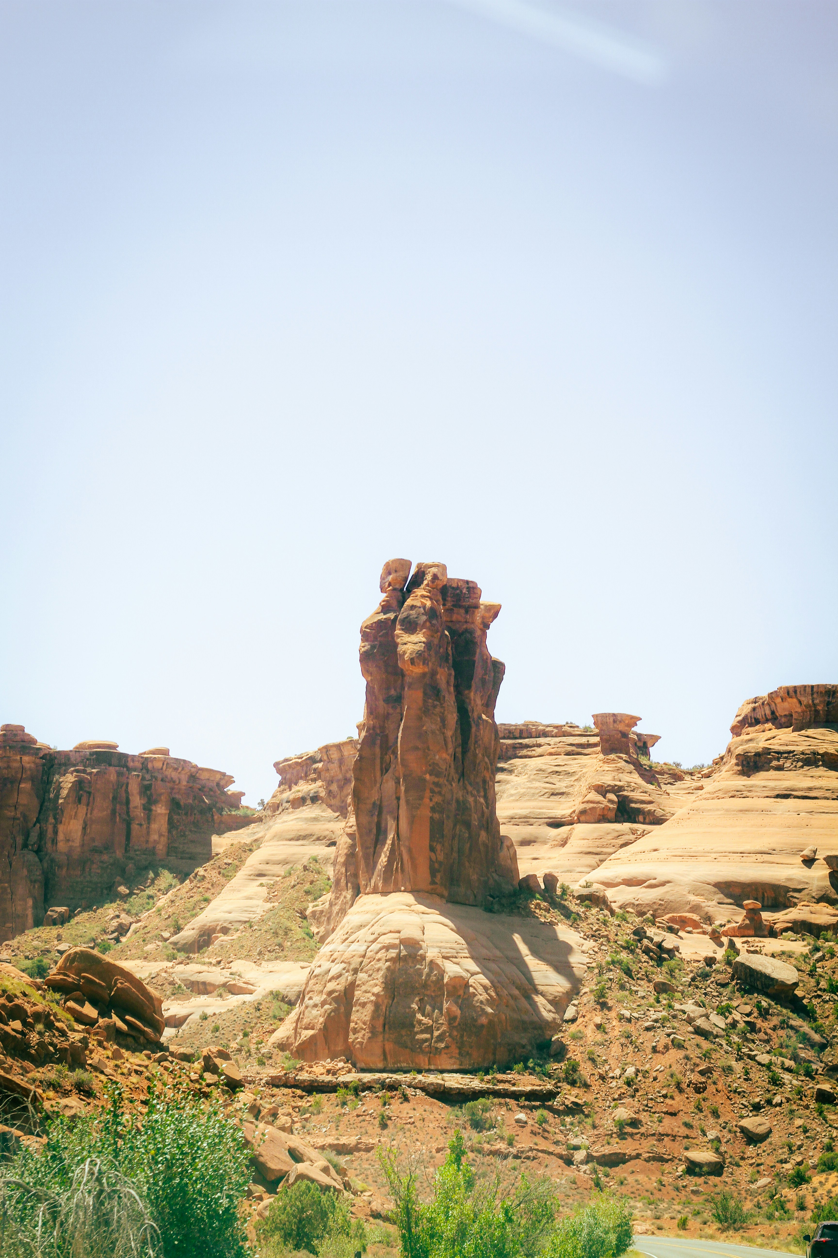 Twin-Column Sentinel Rising from Desert Bedrock