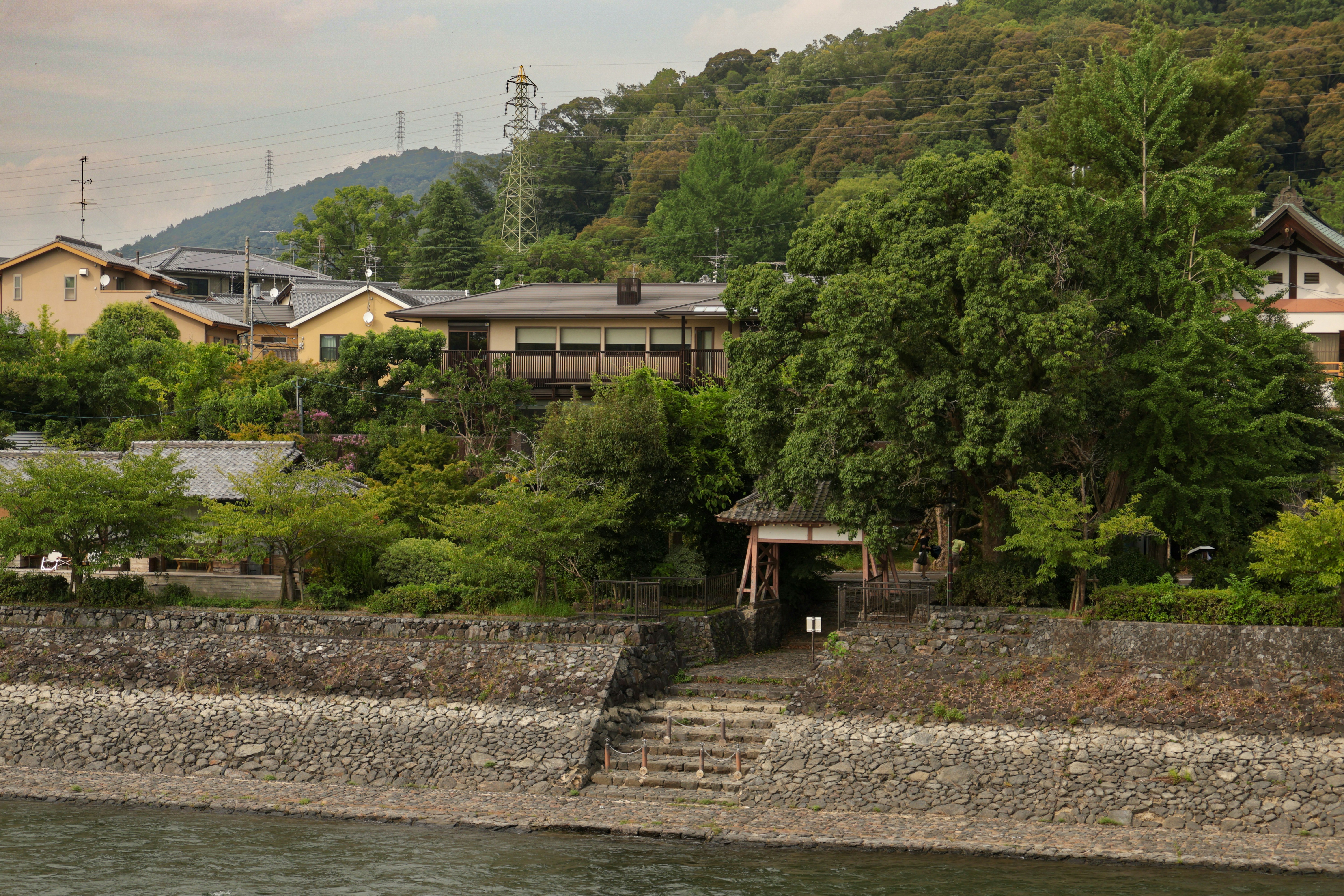 Riverbank Courtyard: Quiet Life by the Stone Wall