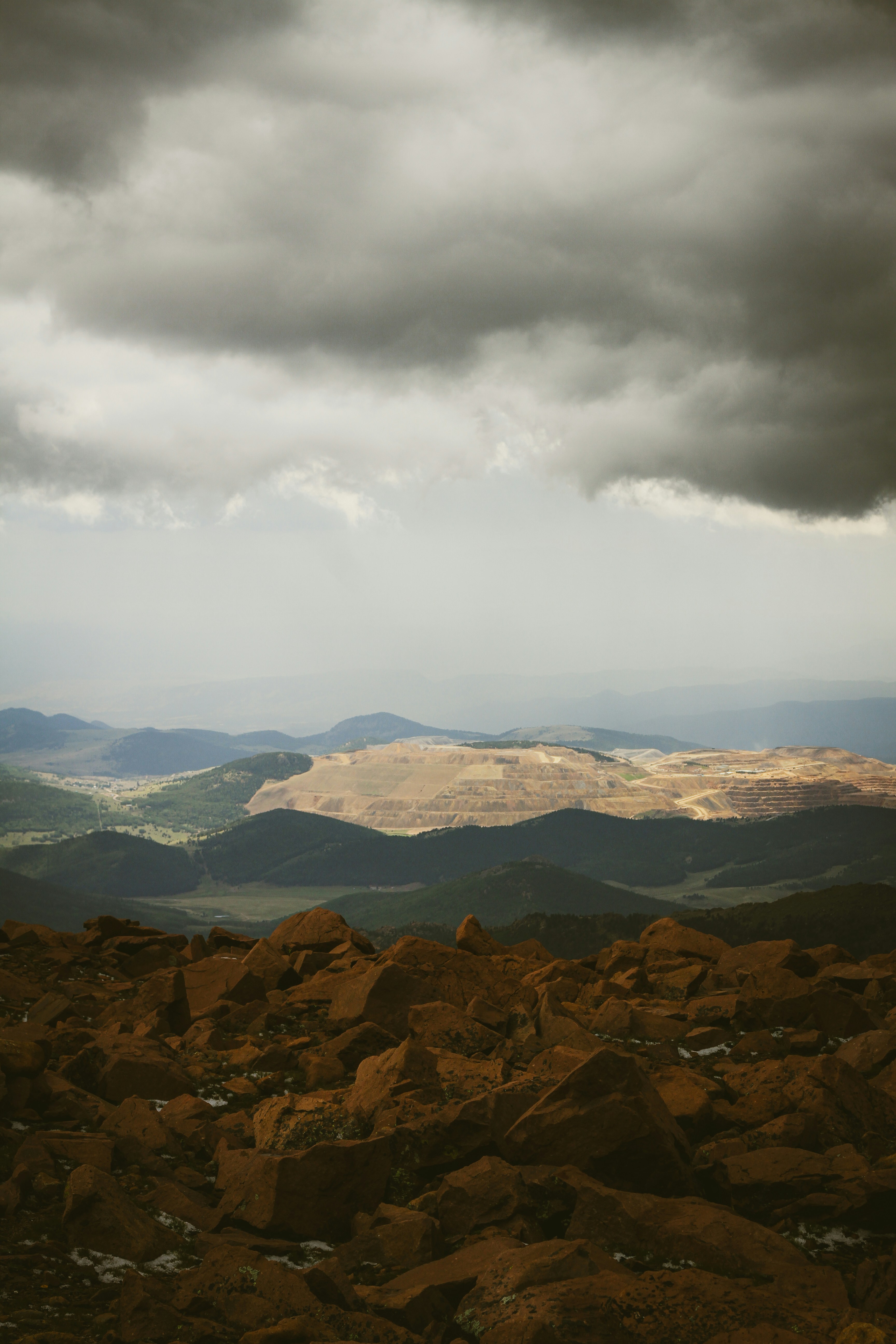 Highland Cloak: A Field of Weathered Ruins Beneath Churning Skies