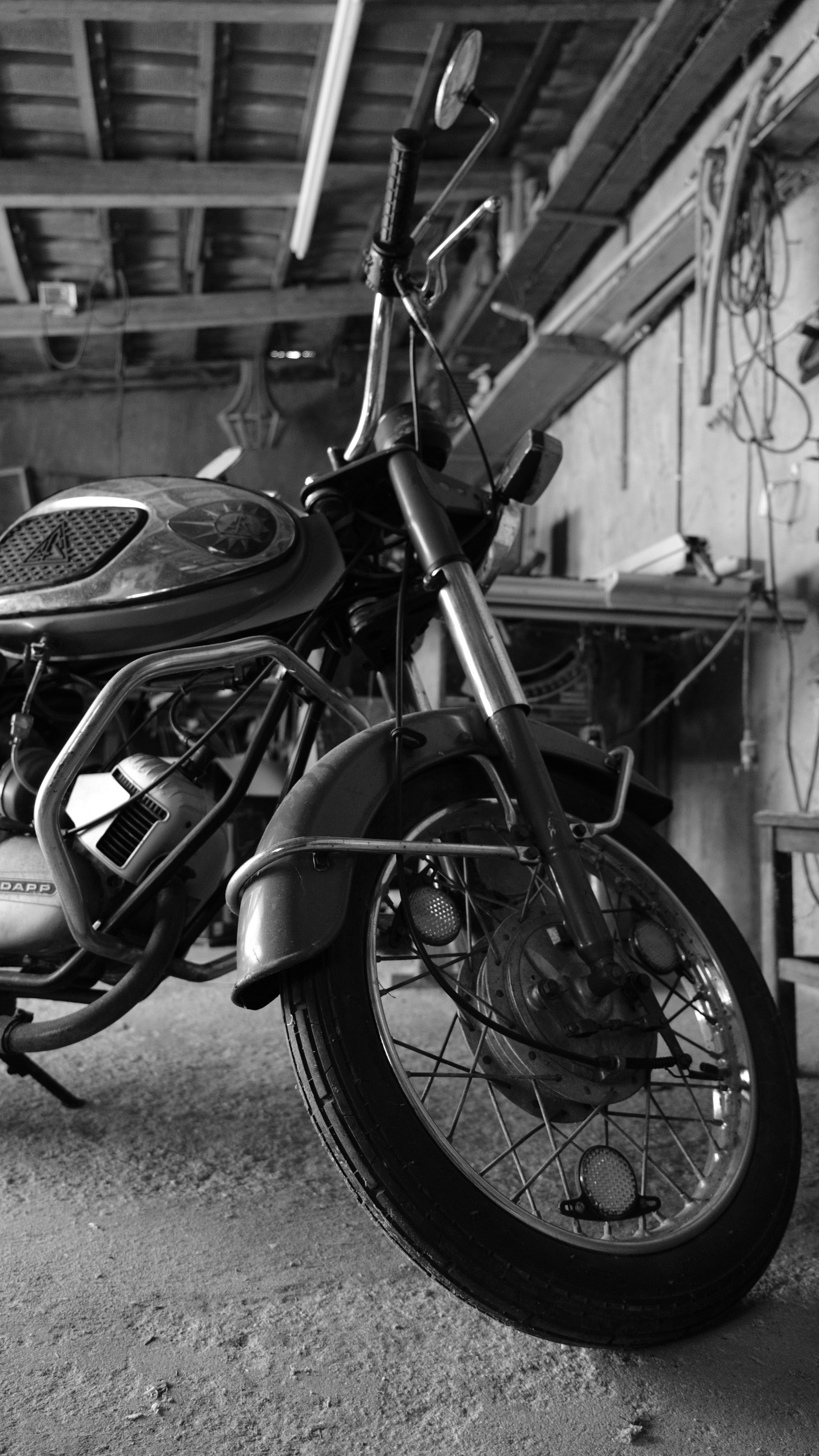 Steam of Steel: A Vintage Motorcycle in a Dusty Garage