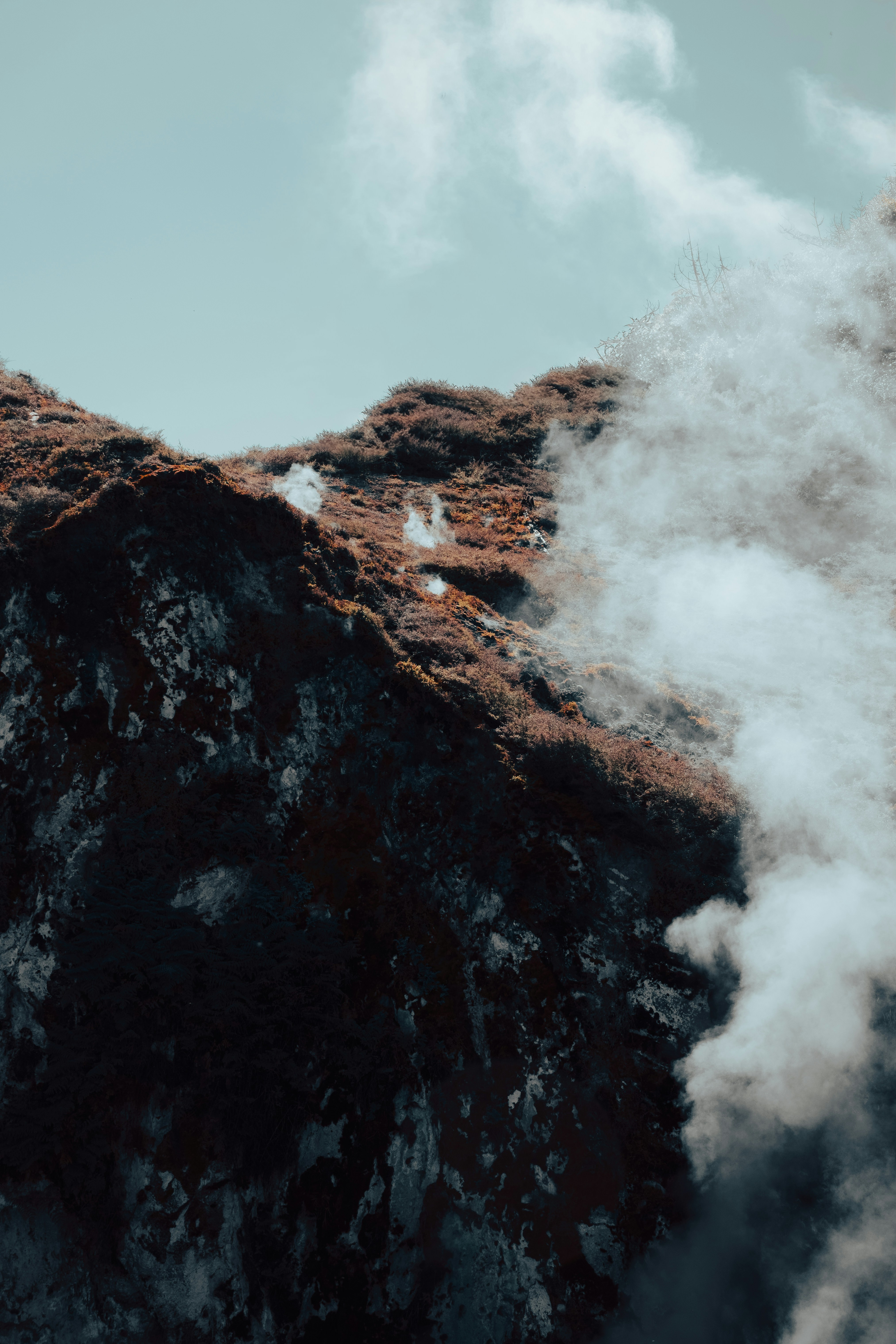 Luminous Steam Against a Cliff Edge