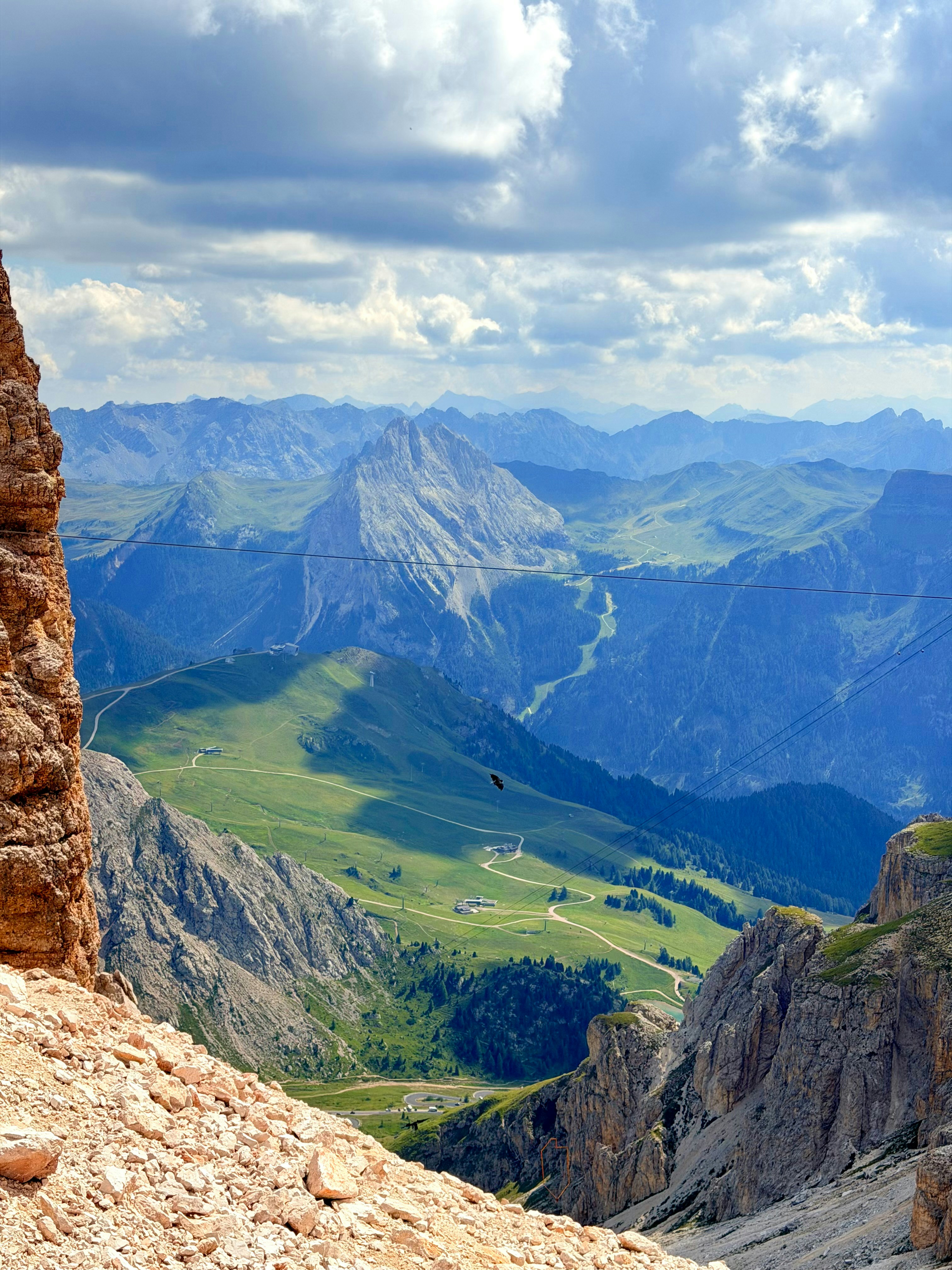 Valley Ribbon: A Cablecar Hover Above Alpine Green