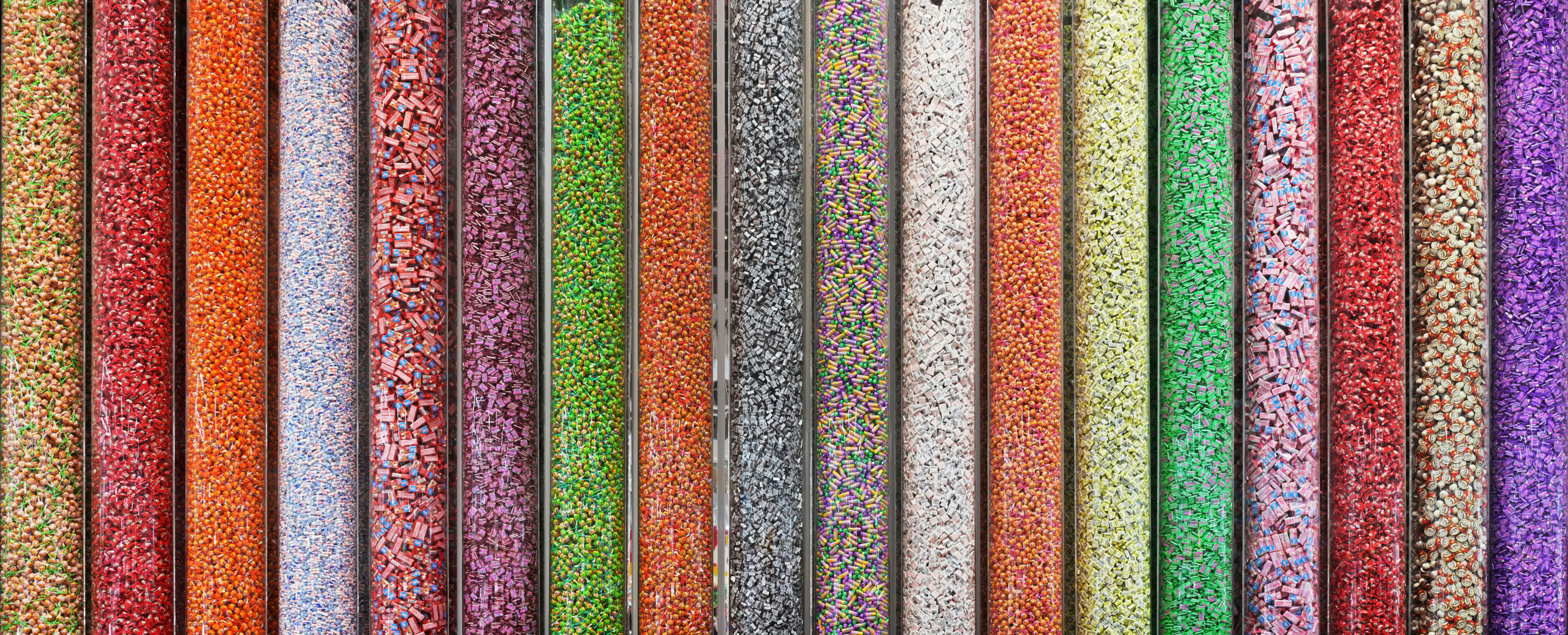 Spectrum of Sprinkles: a row of glittering color cylinders
