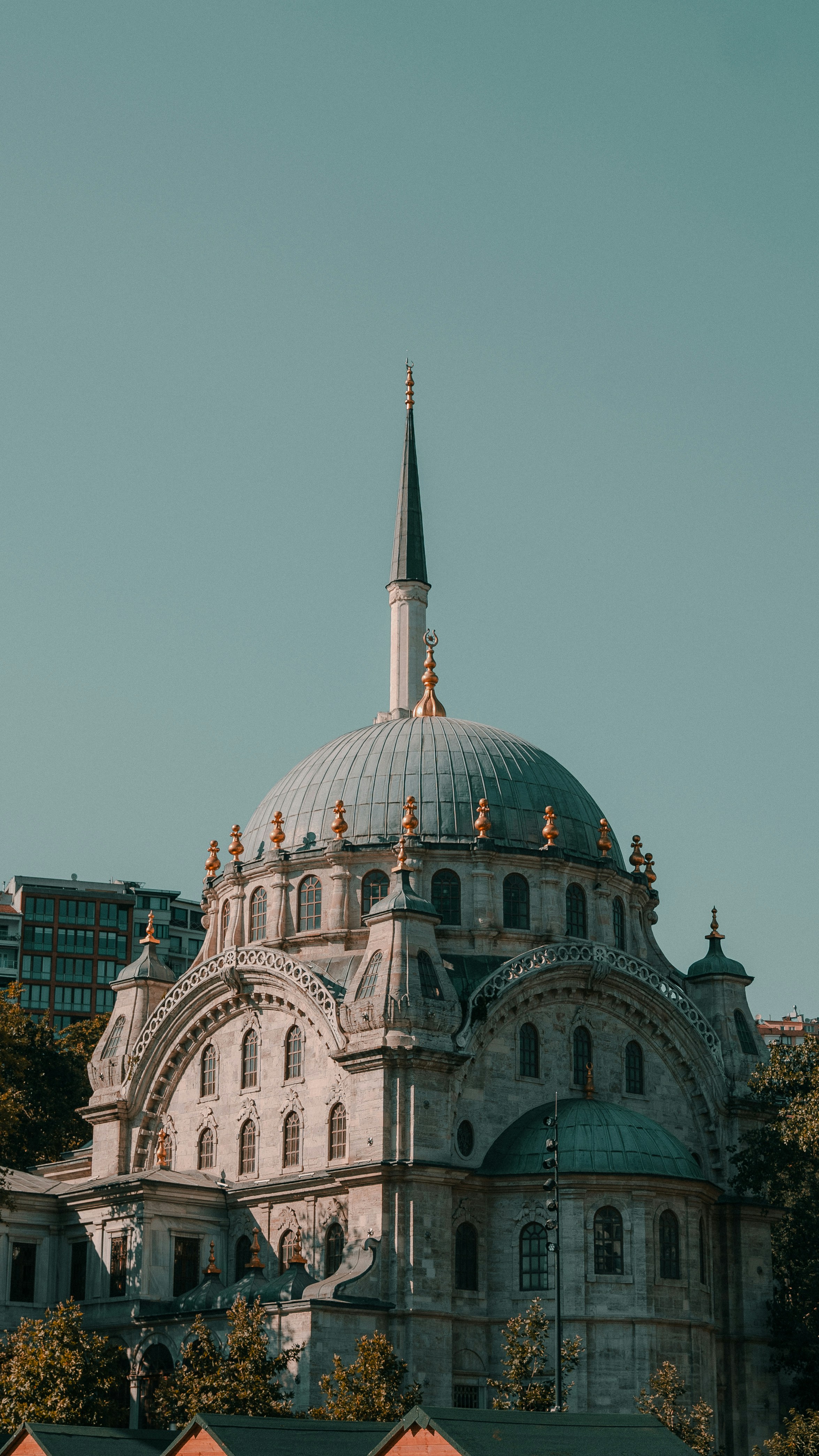 Domed Mosque Crowned by Spire Rising Above City