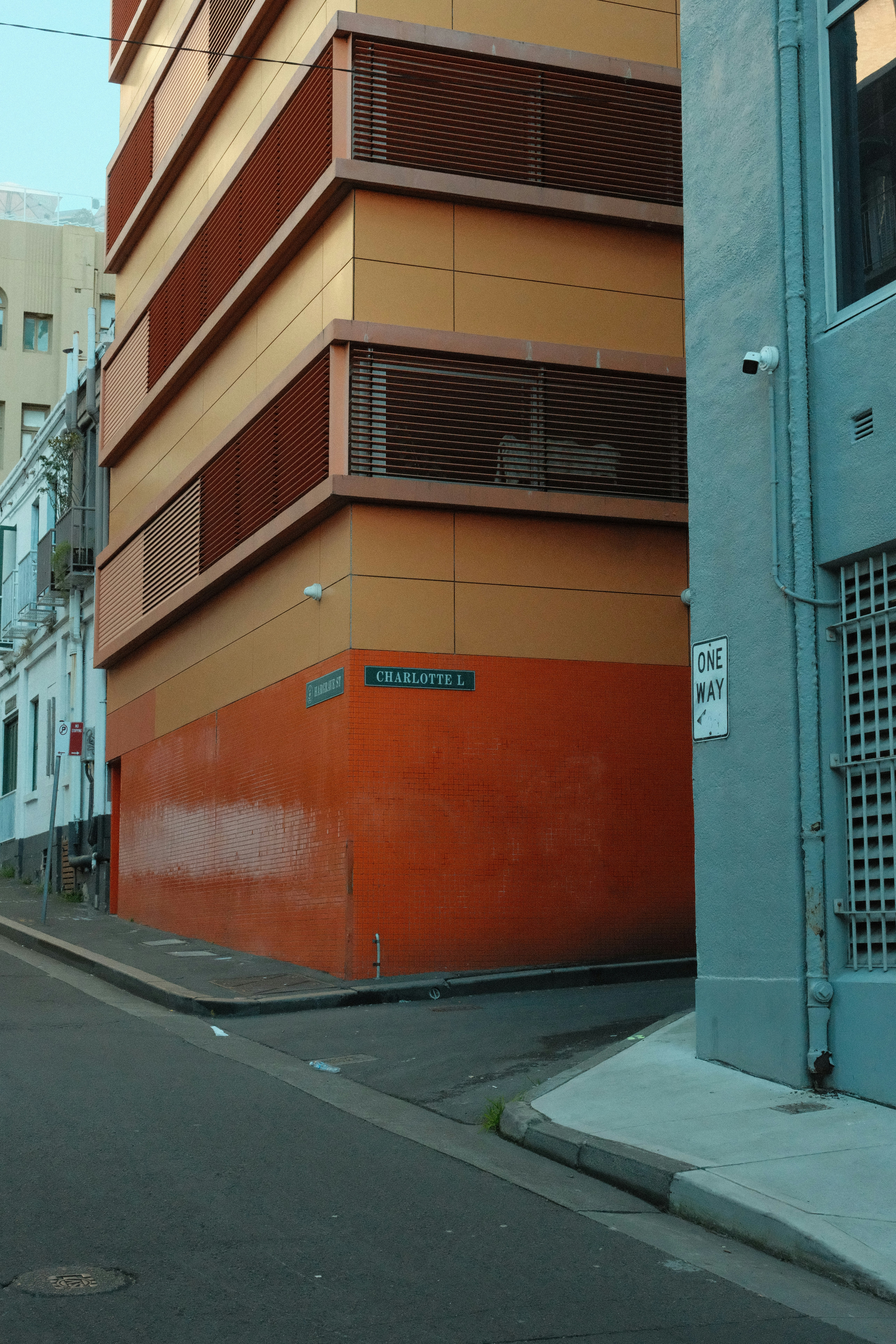 Orange-Brick Corner: Street Sign Portrait at Charlotte Street