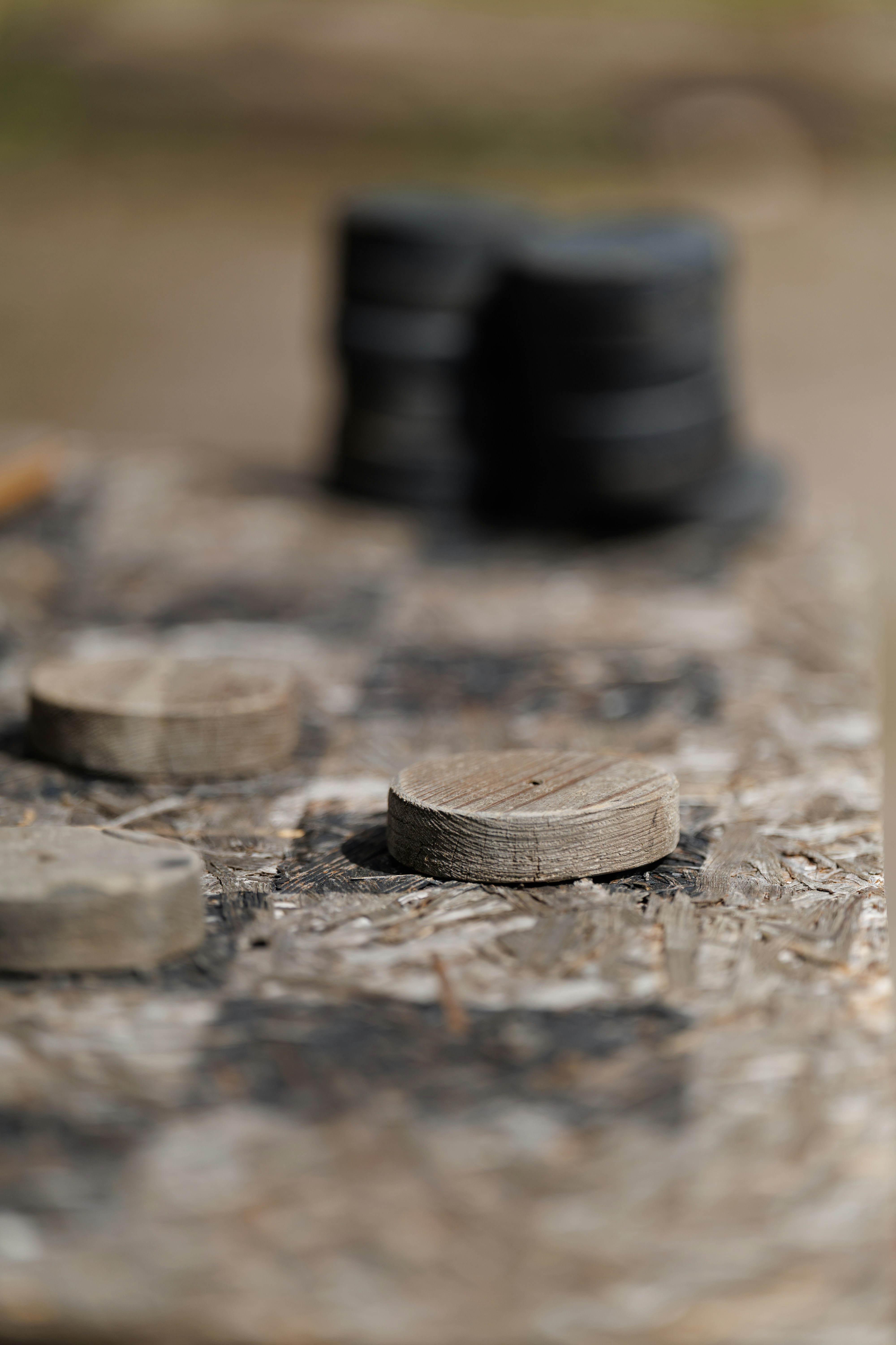 Weathered wood tokens: a quiet grove of time on a wooden board