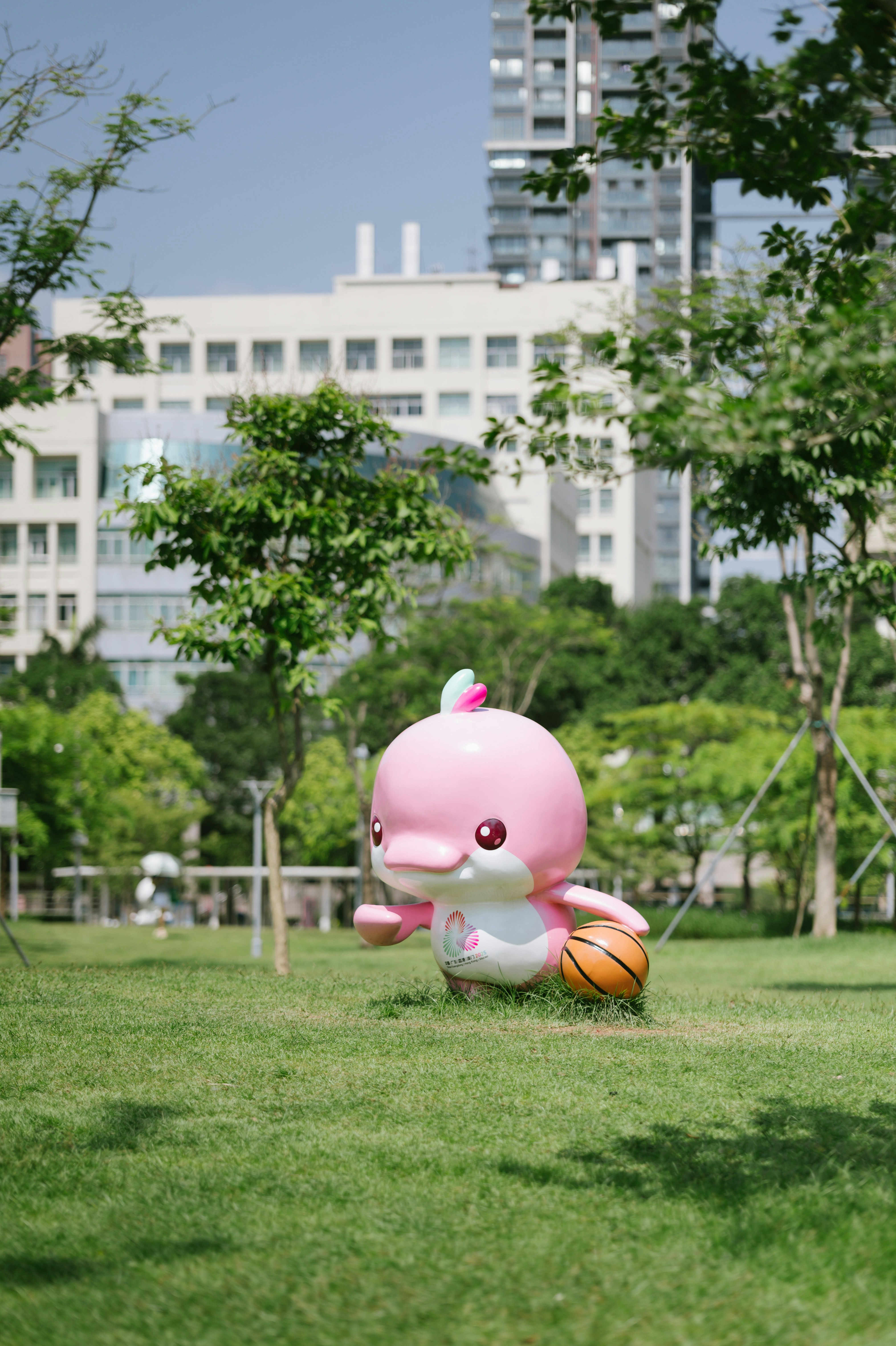 Bounce-Ride in the Green: A Neon-Pink Playground Stalwart