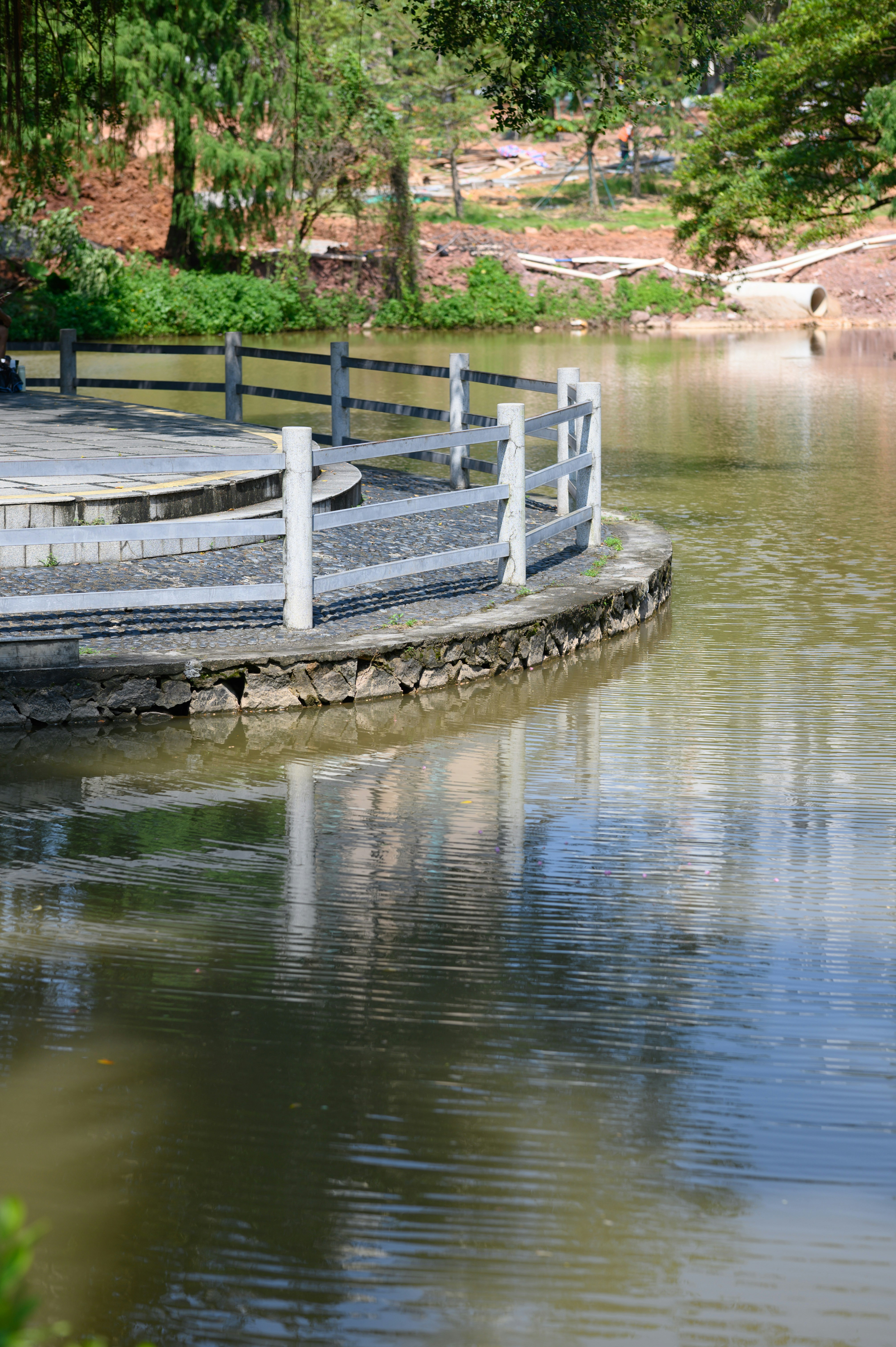 Circular pier at the lakeside: calm platform encircling the water