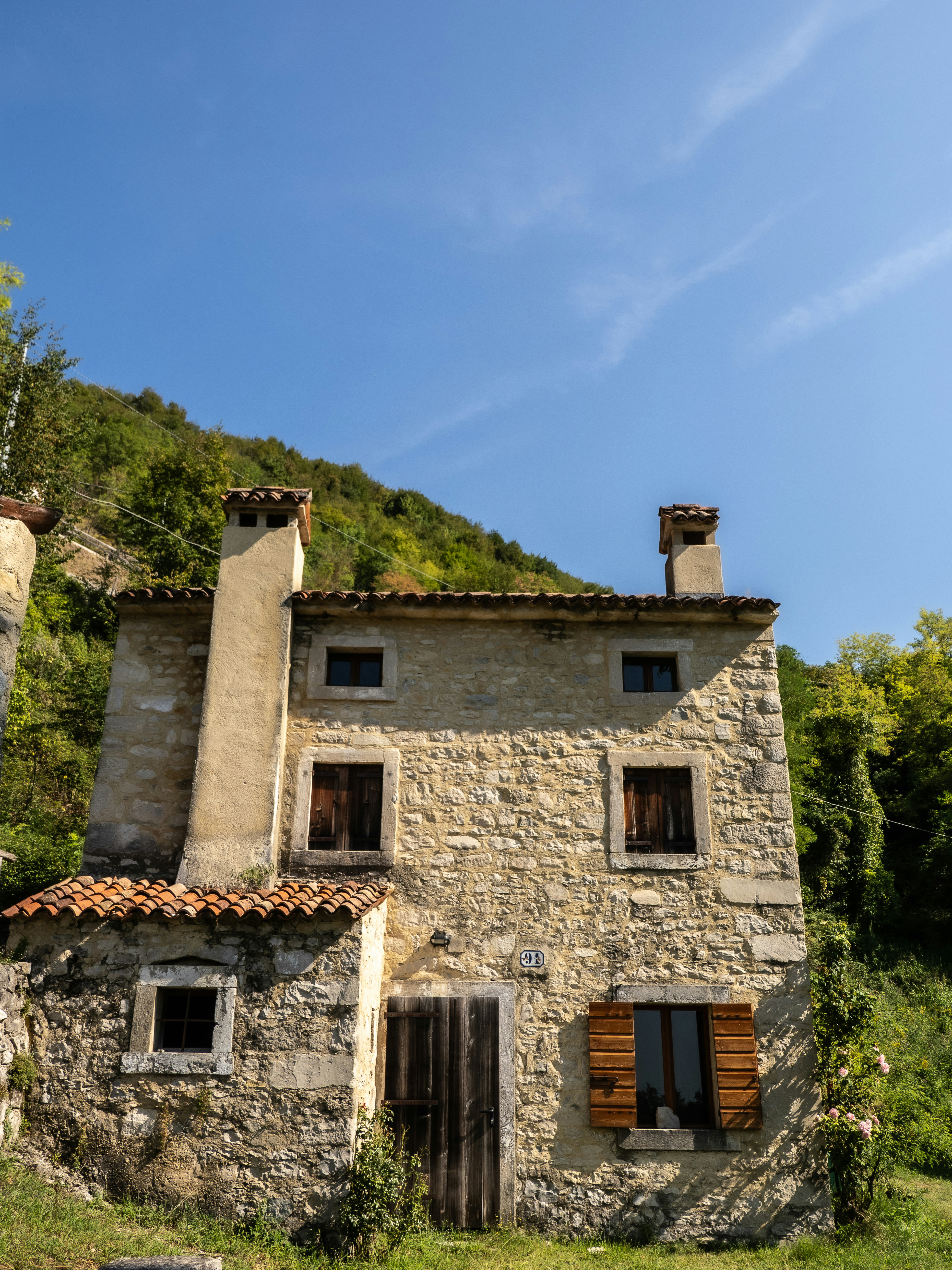 Sunlit Stone House Rising from the Hill