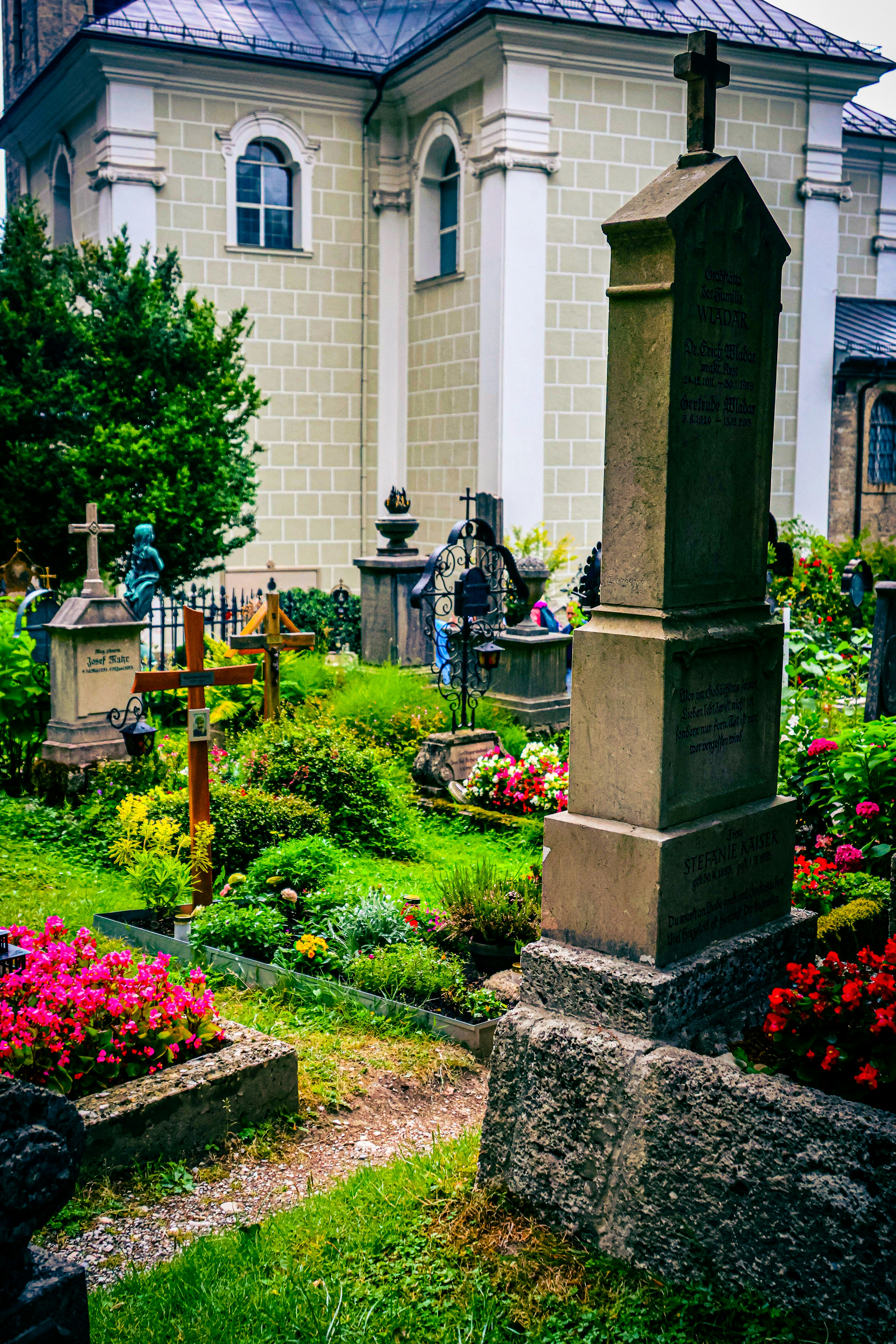Cemetery Garden with Weathered Obelisk and Framed Church