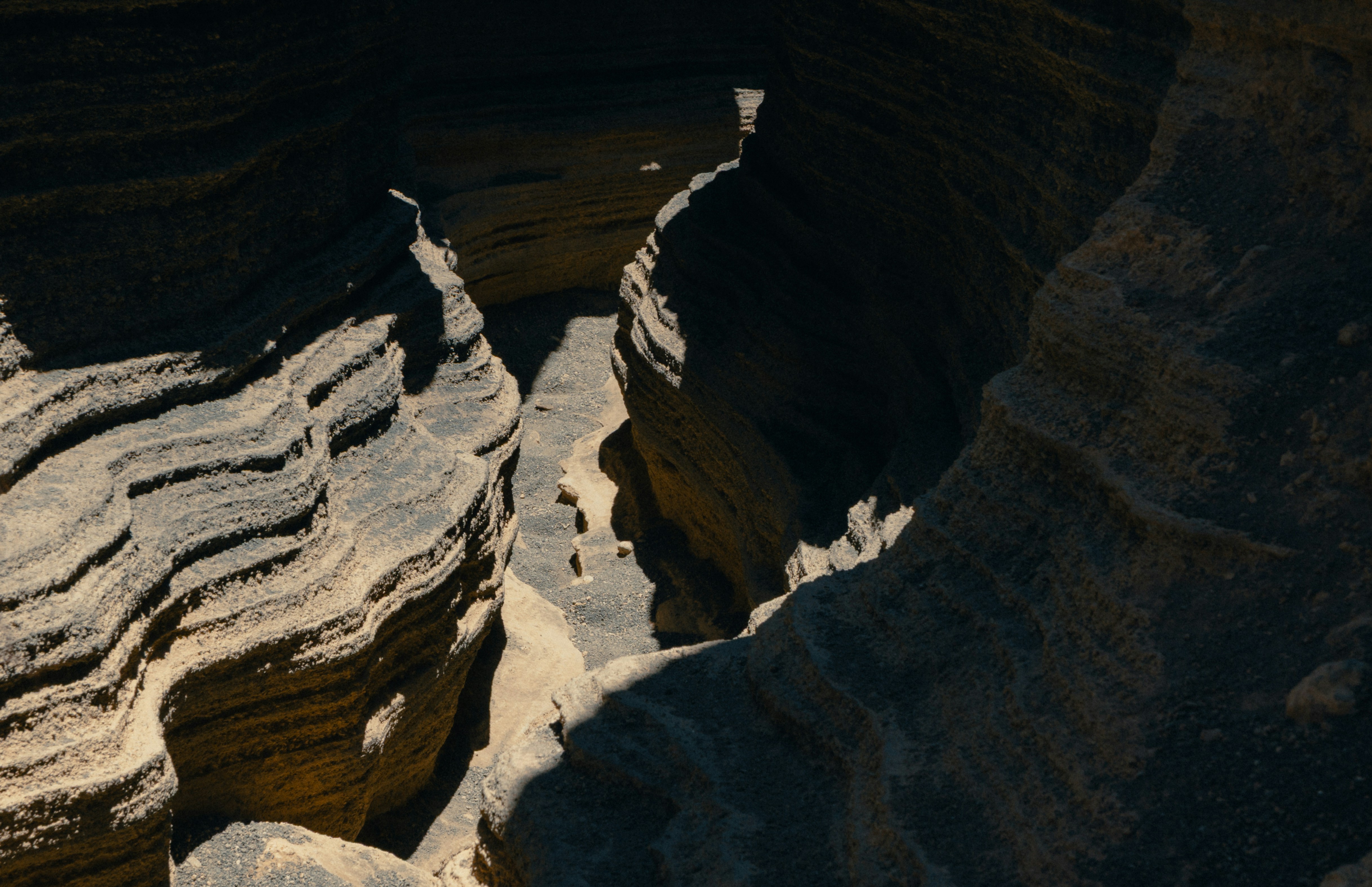 Sunlit Rift: Carved Staircase Between Silent Cliff Faces