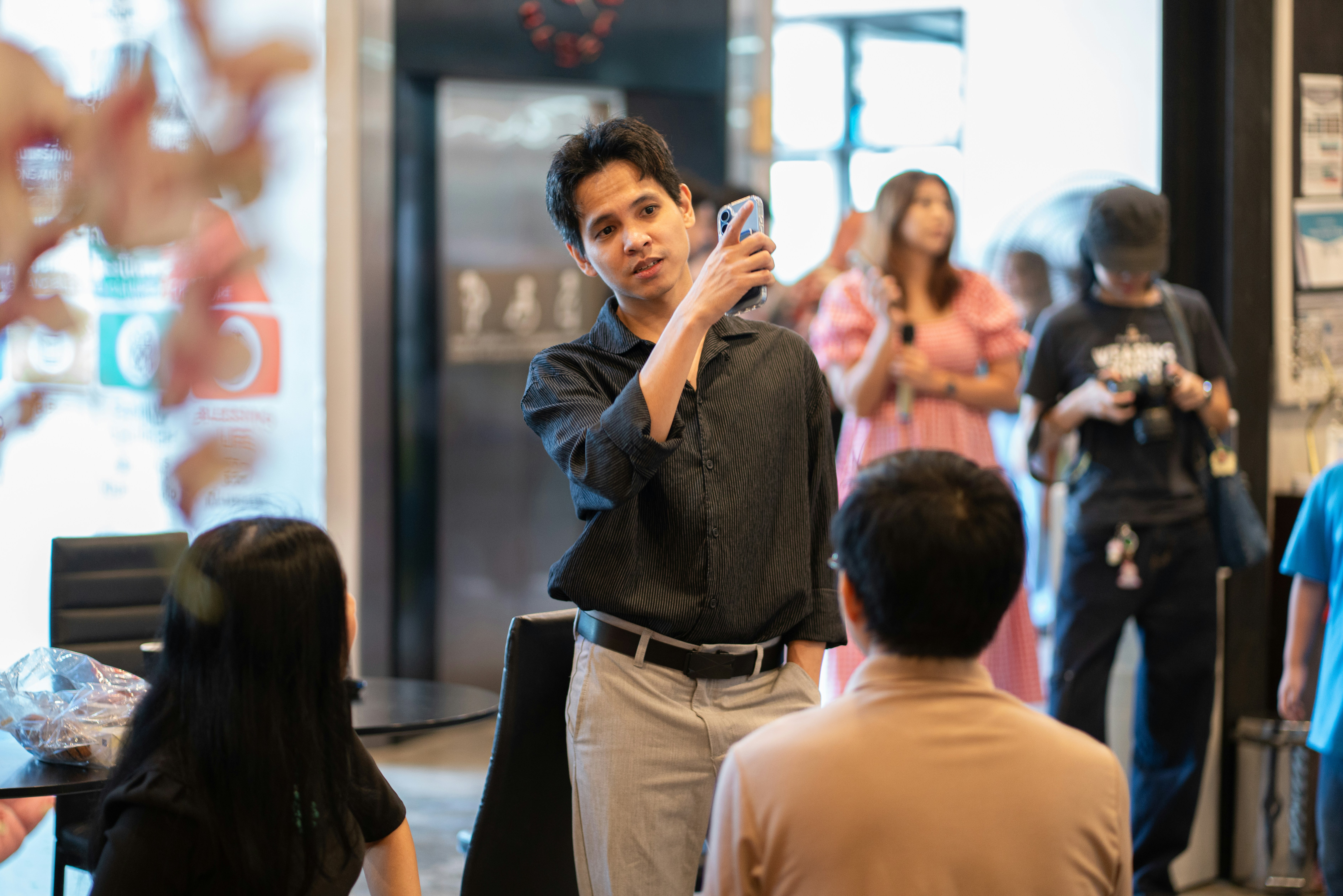 Pose and Protest: Presenter Demonstrates Smartphone Moments