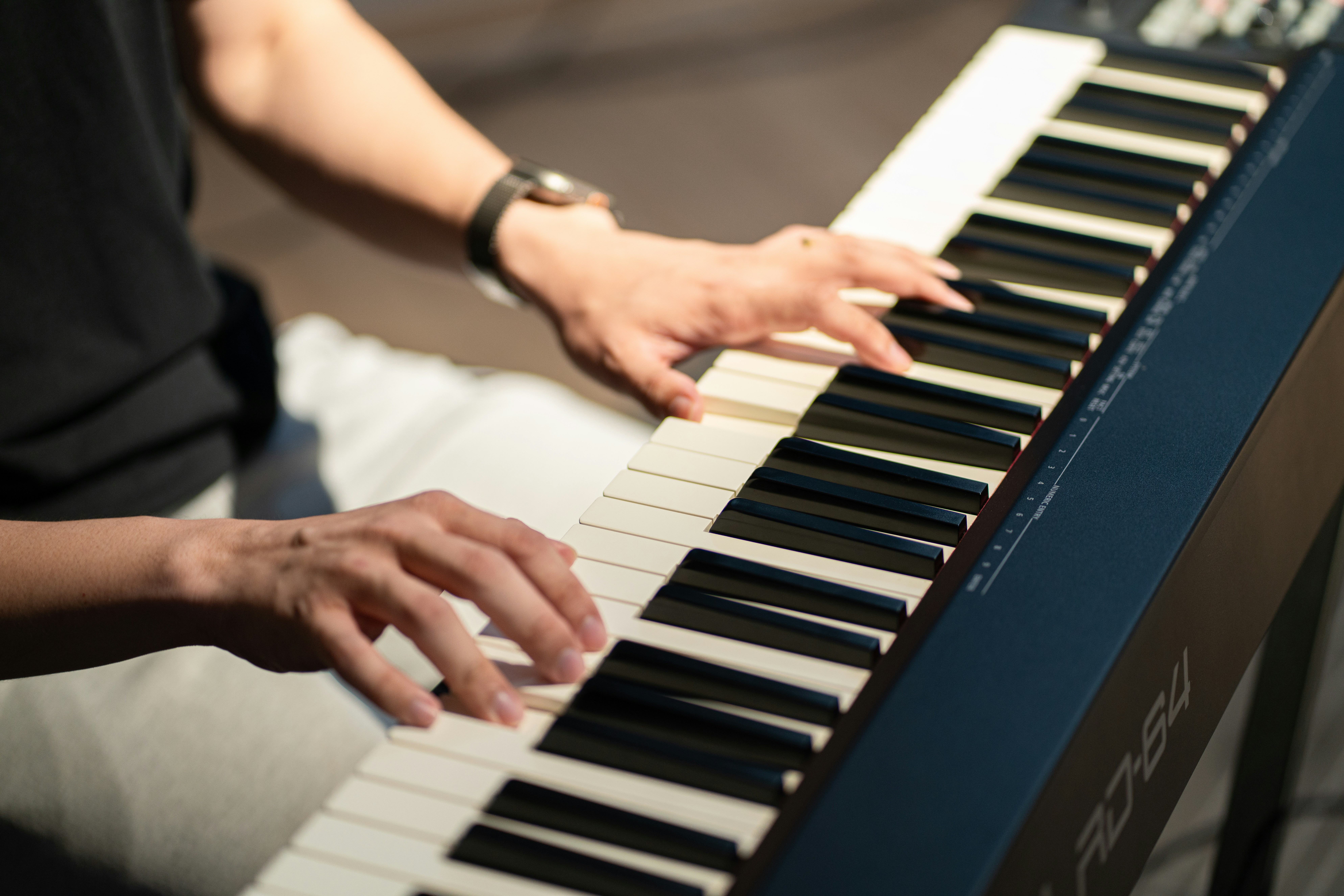 Keys in Focus: A Pianist’s Quiet Hands on a Studio Keyboard