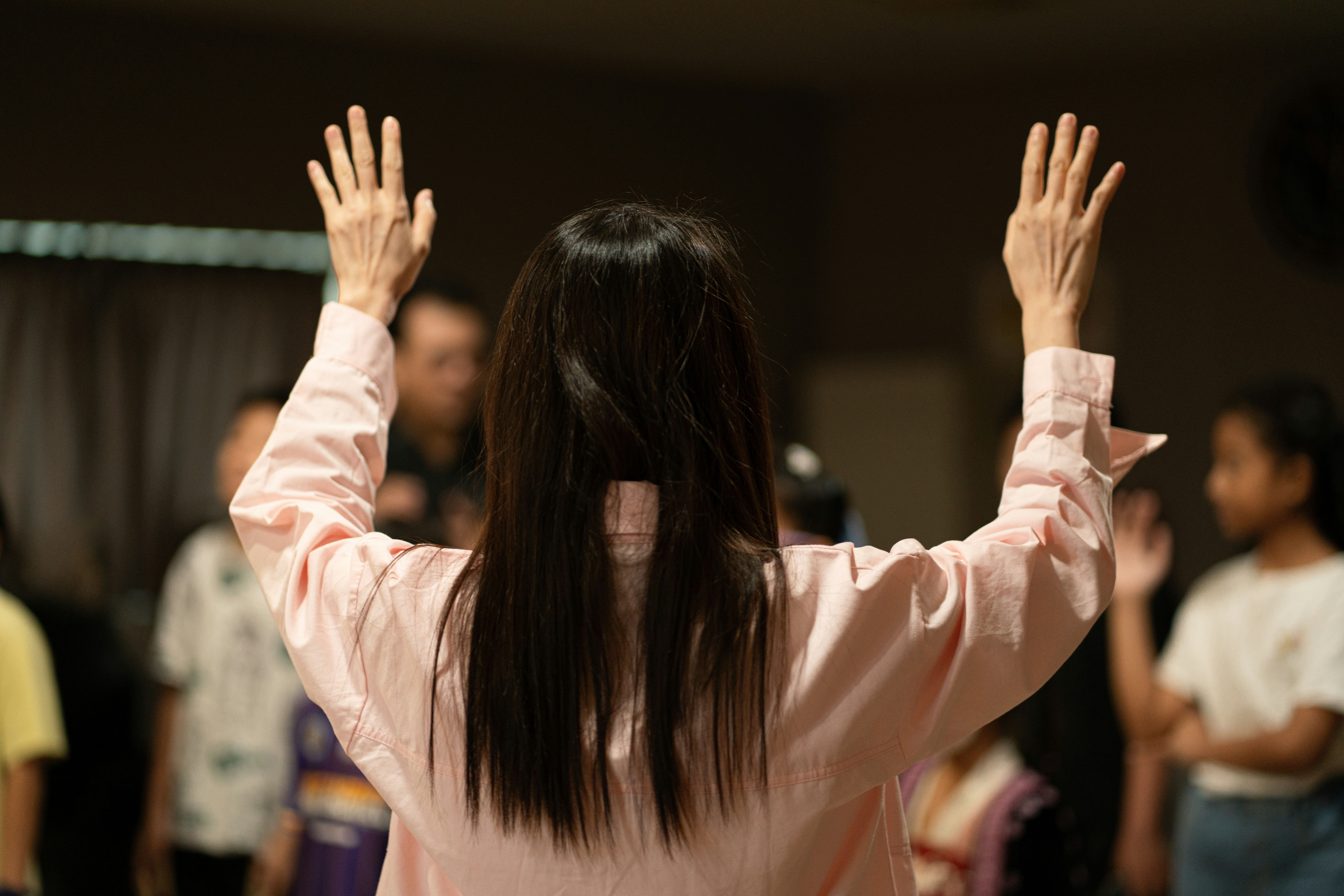 Raise and Release: A Back View of a Group Spirit