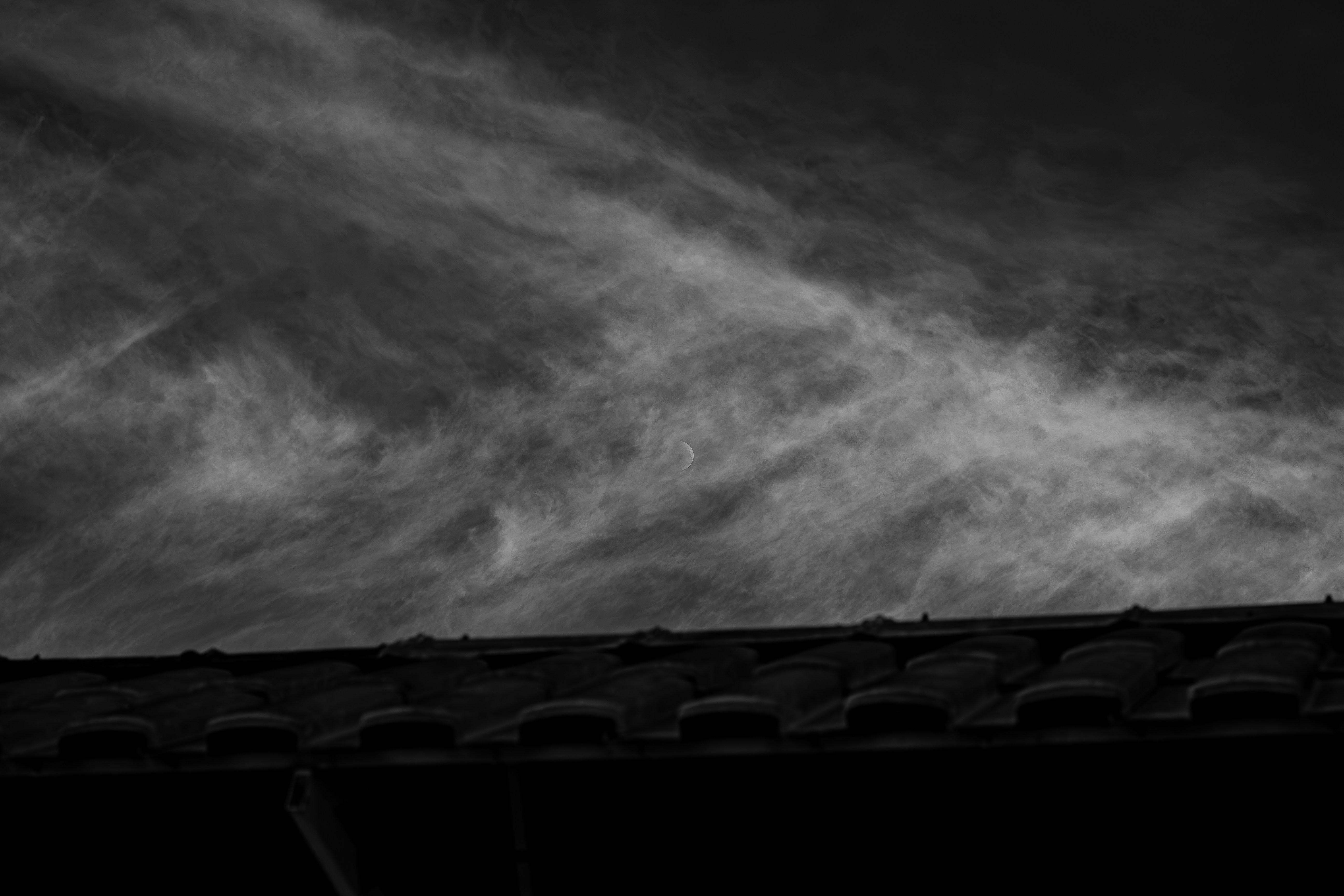 Shadowed Tile Ridge Beneath a Whispering Sky