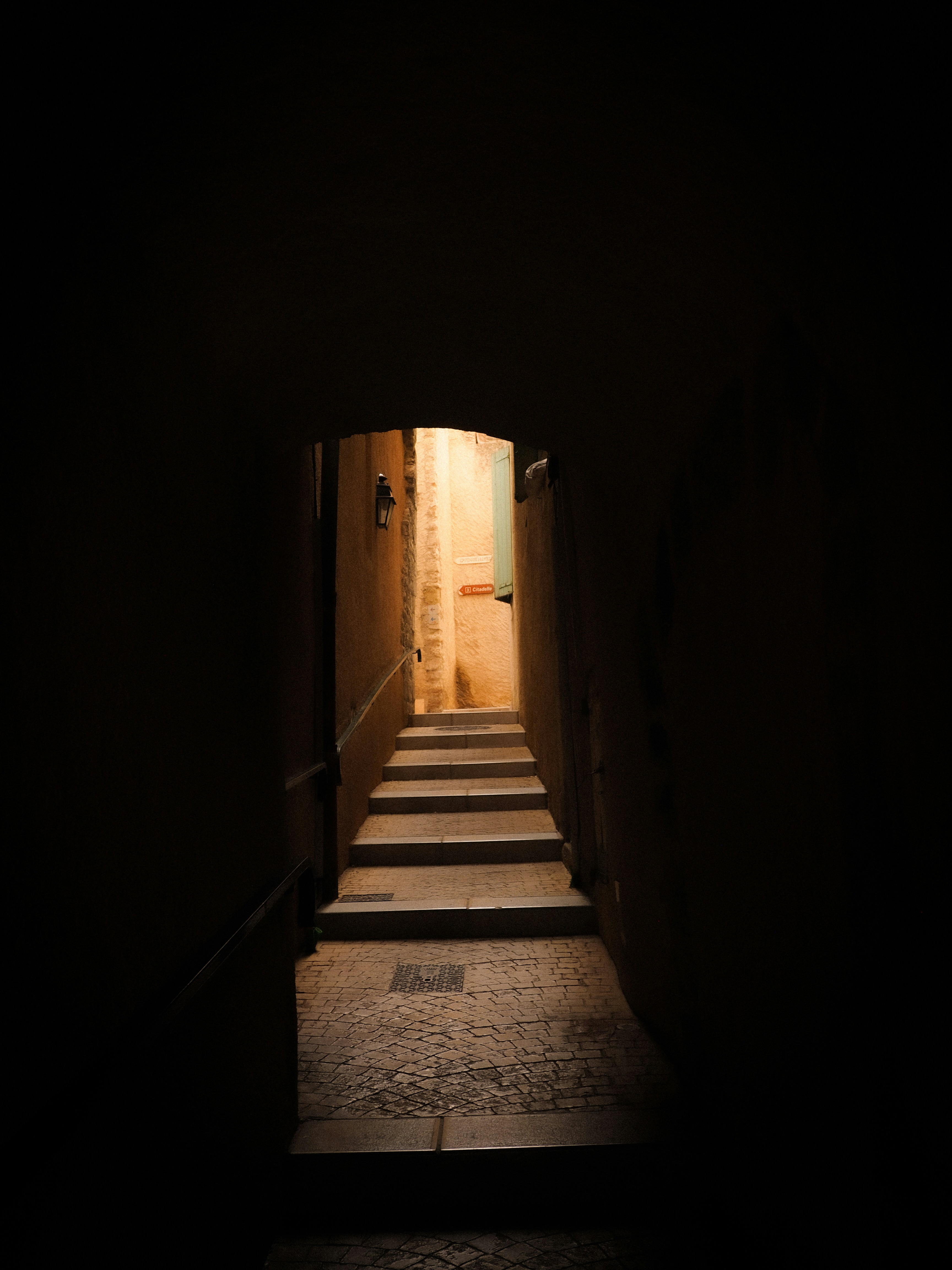 Sunlit Staircase to the Narrow Corridor