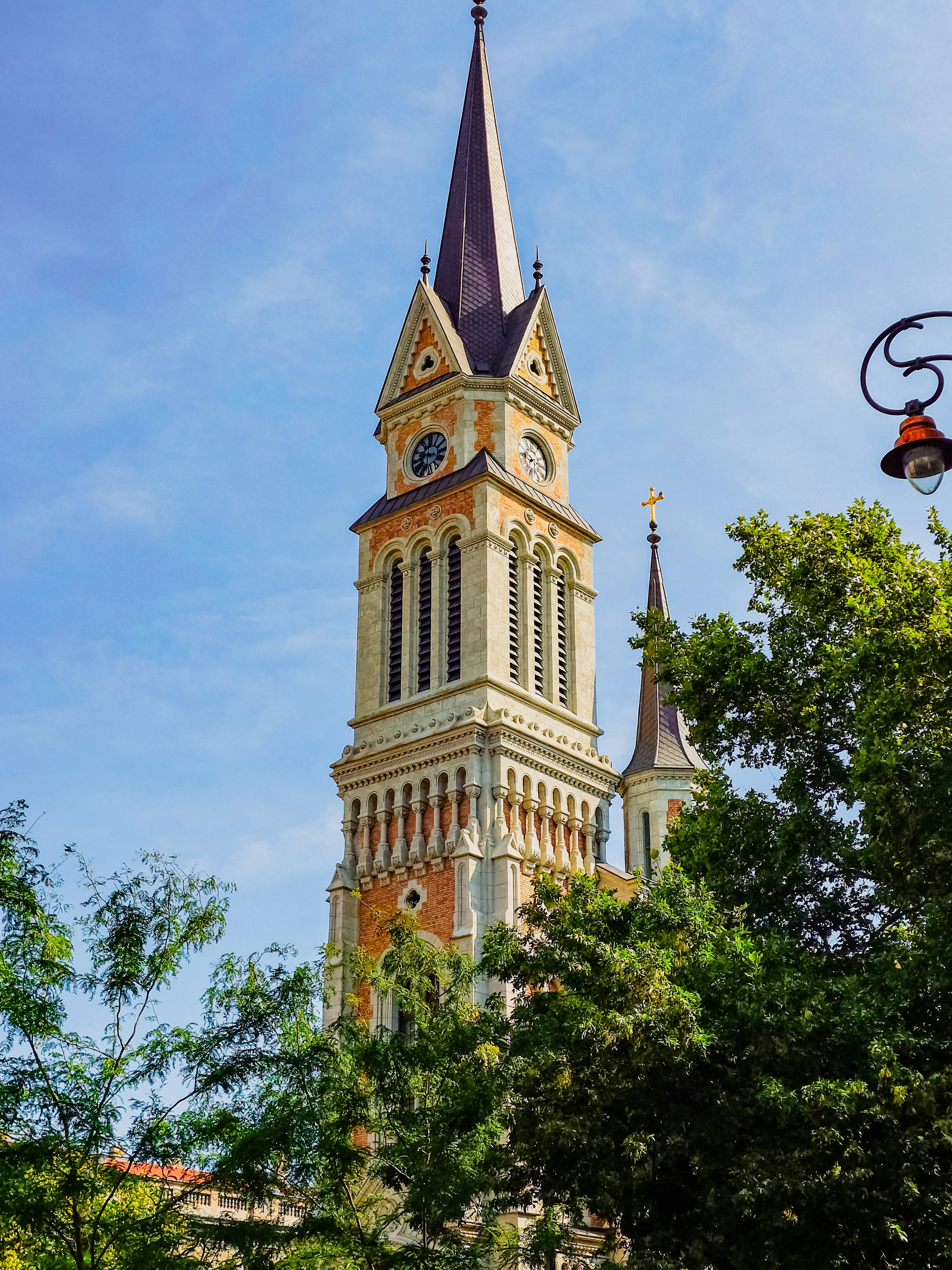 Clocktower Rising: A European Heritage Spire Against a Bright Sky