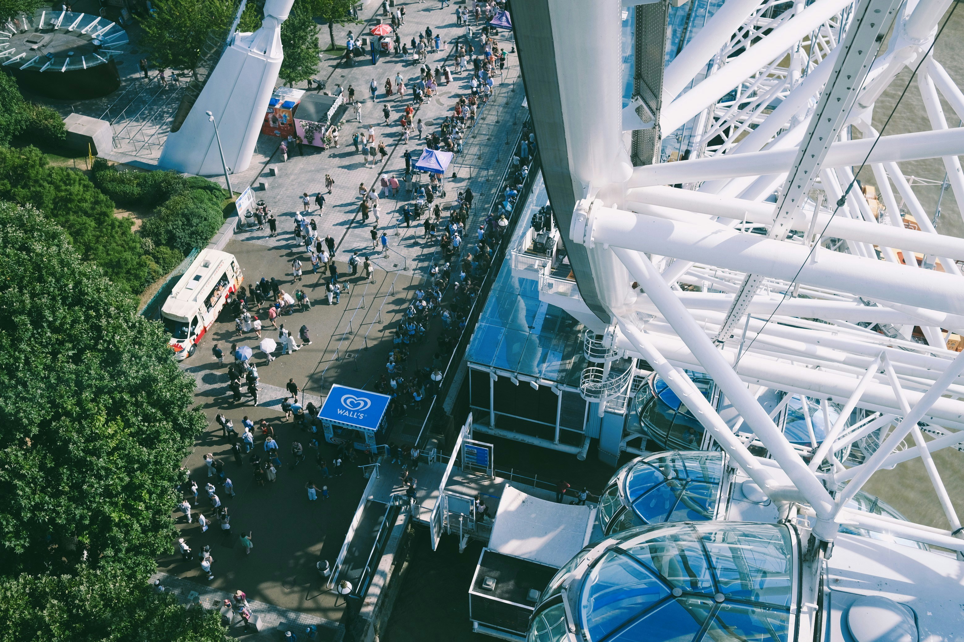 Aerial Pulse: City Footfall Beneath a Structural Canopy