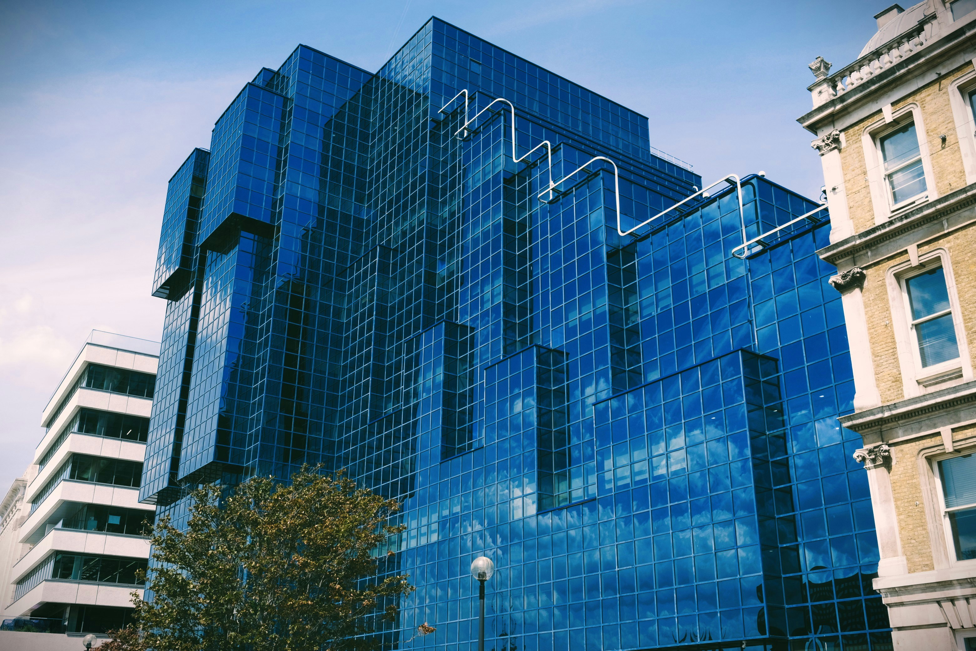 Glass Facade Symphony: Urban Geometry Reflecting the Sky