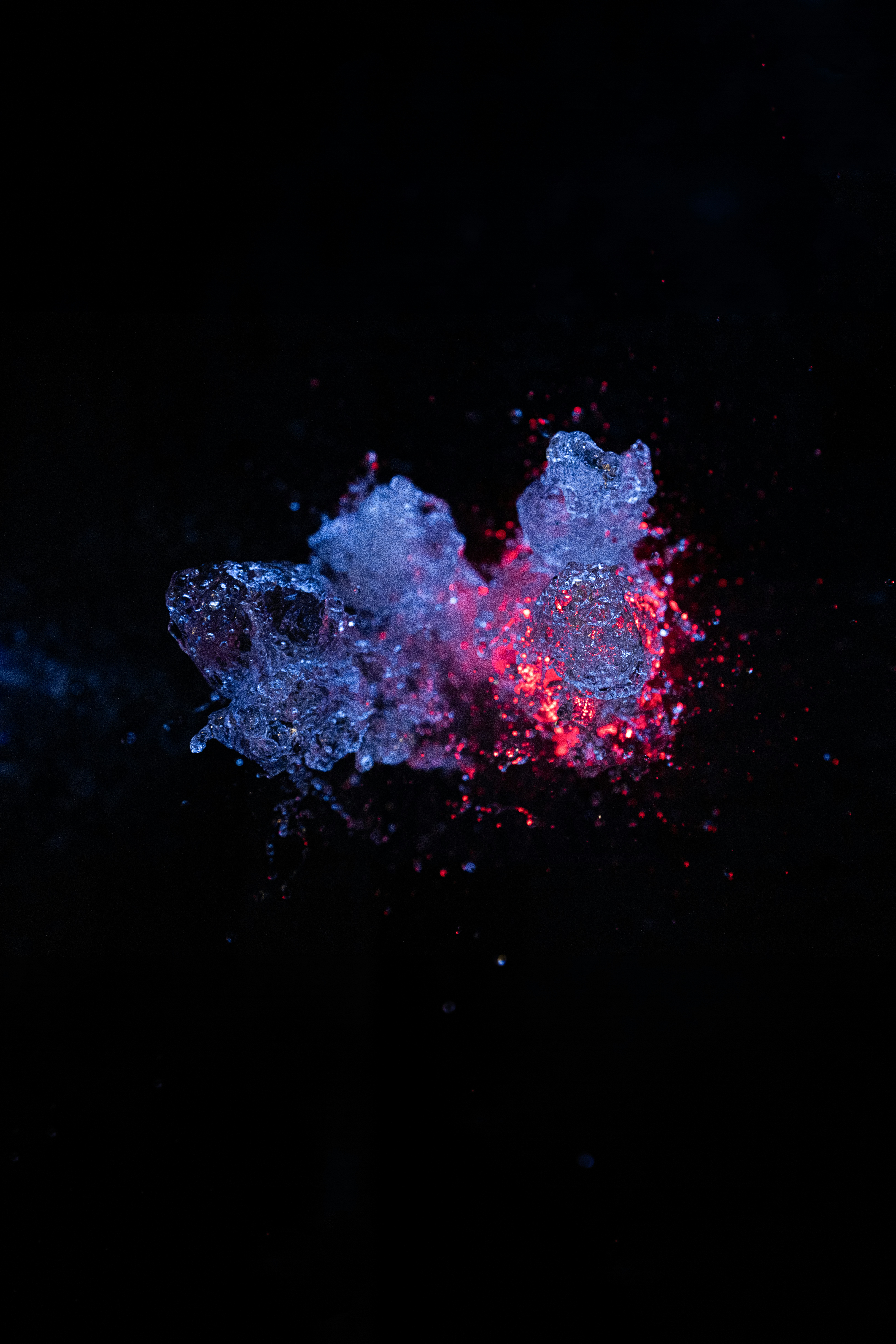 Red-Blue Nebula Duel: Ice Crystals Amid Starlit Darkness