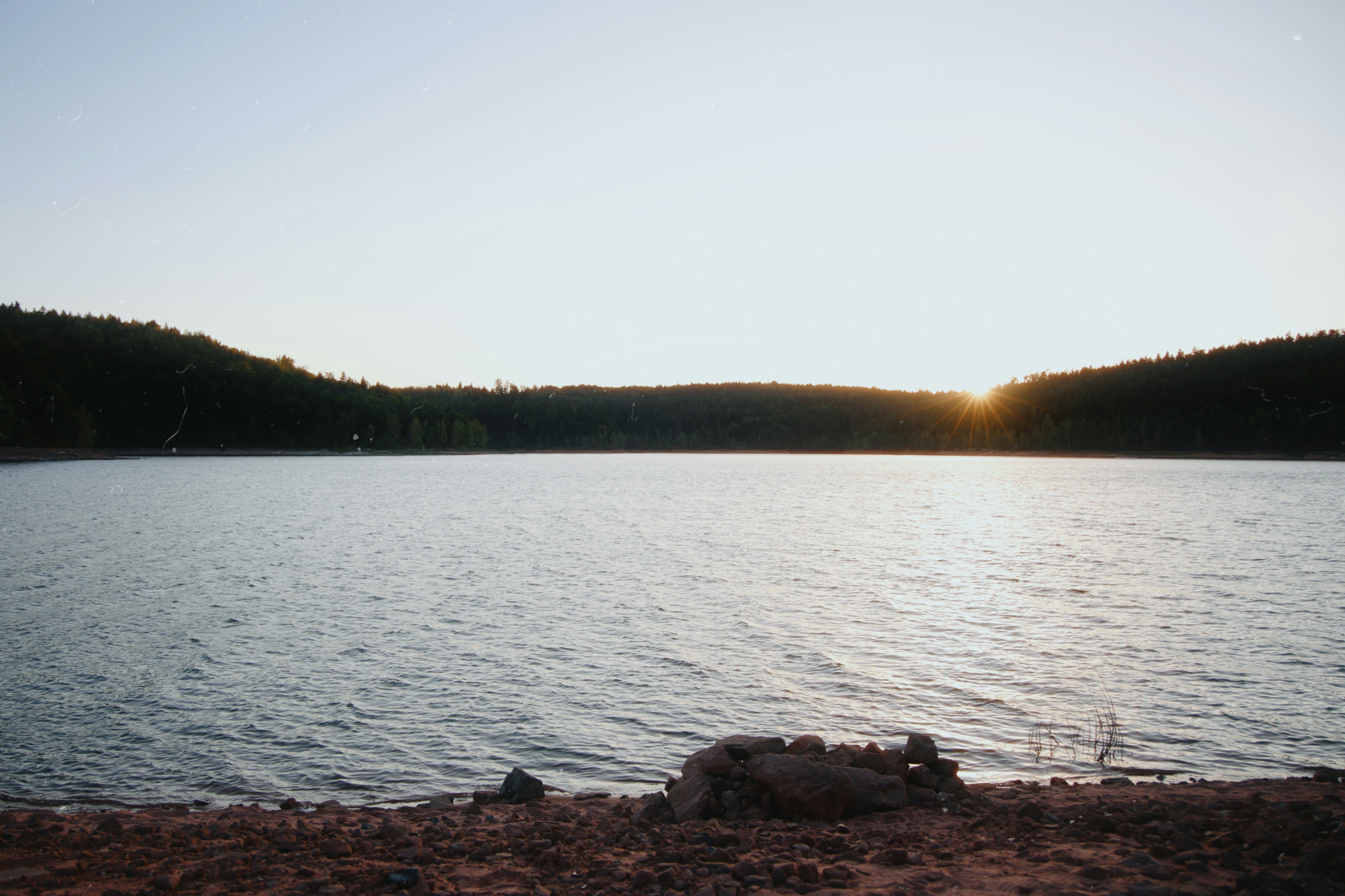 Sunset on a Quiet Lake Rimmed by Forest