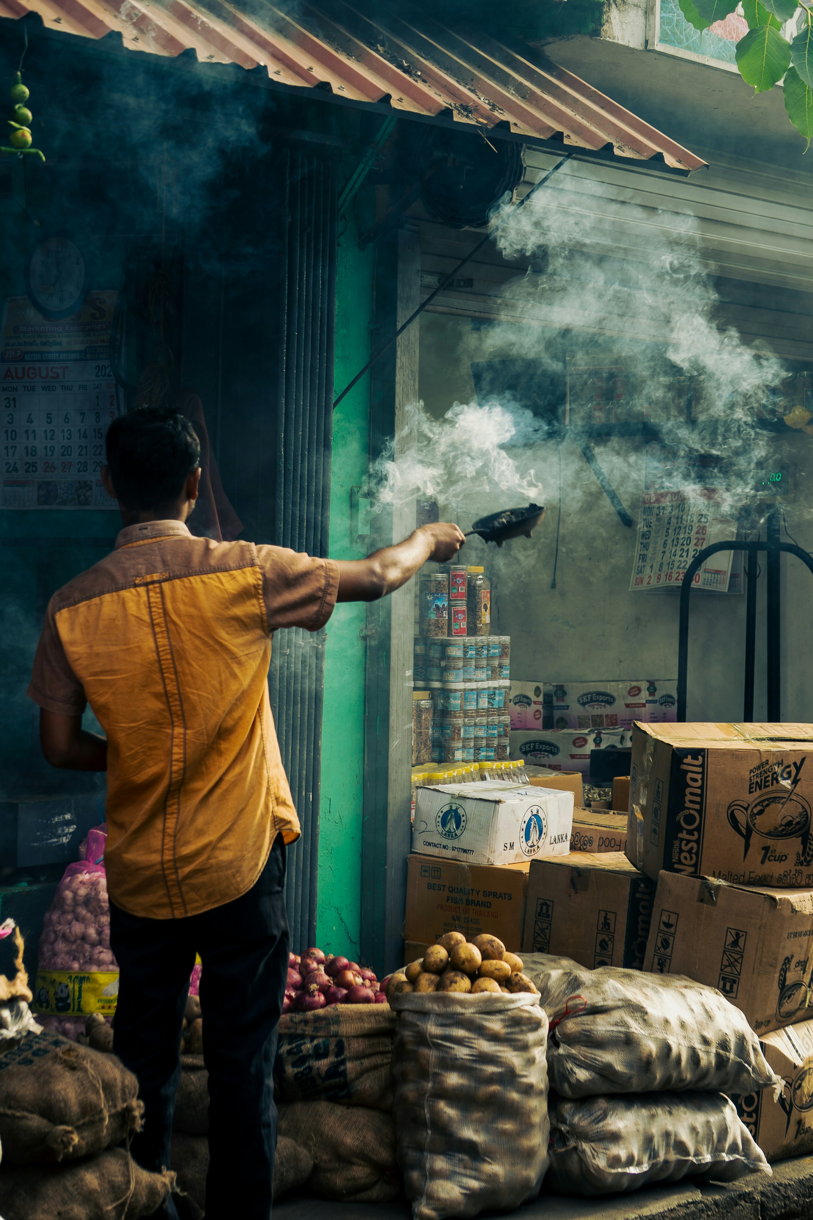 Smokestack Throw: Vendor Aims a Shout Amid Hazy Marketfront