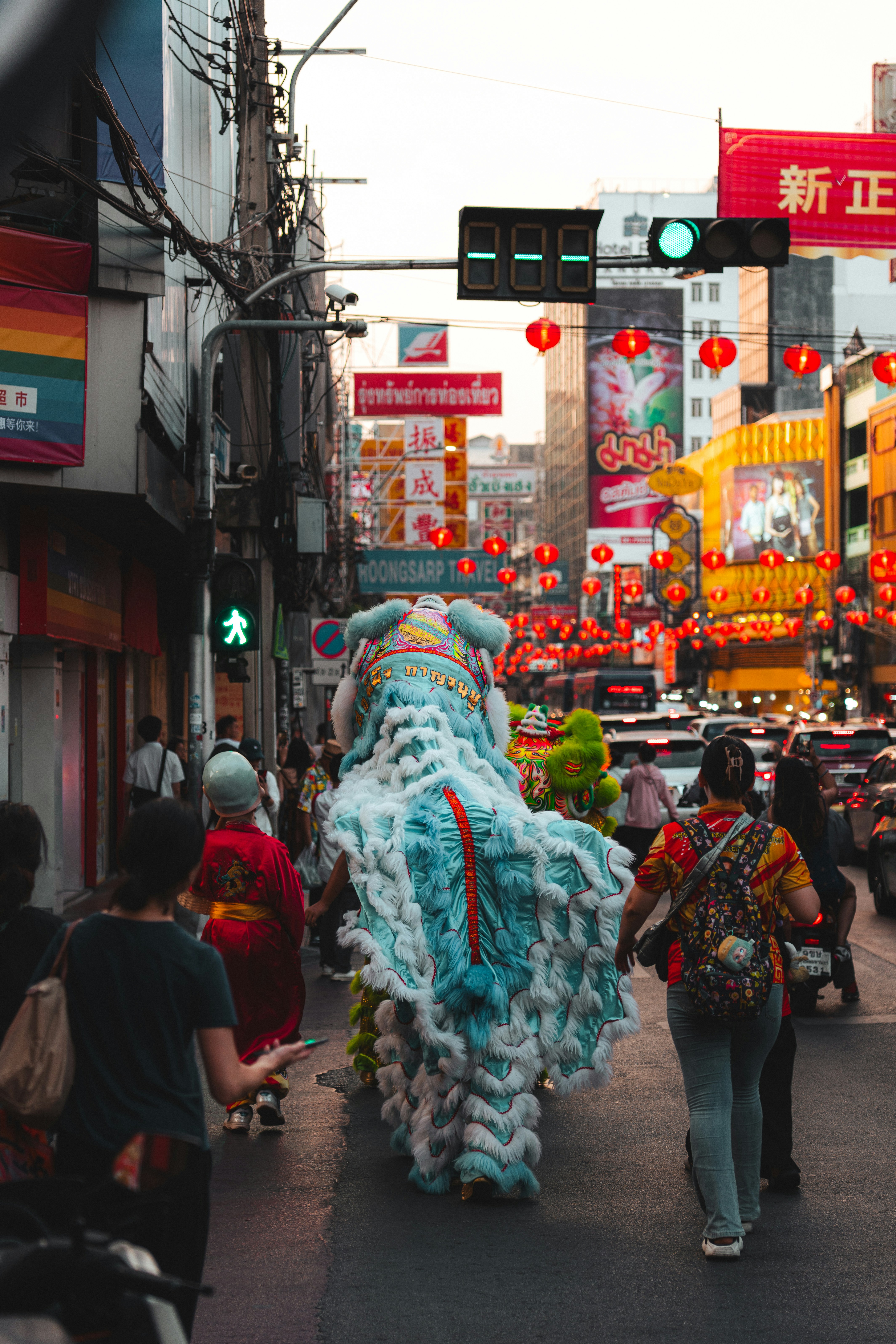 Vibrant Street Dragon Parade under Neon Lanterns