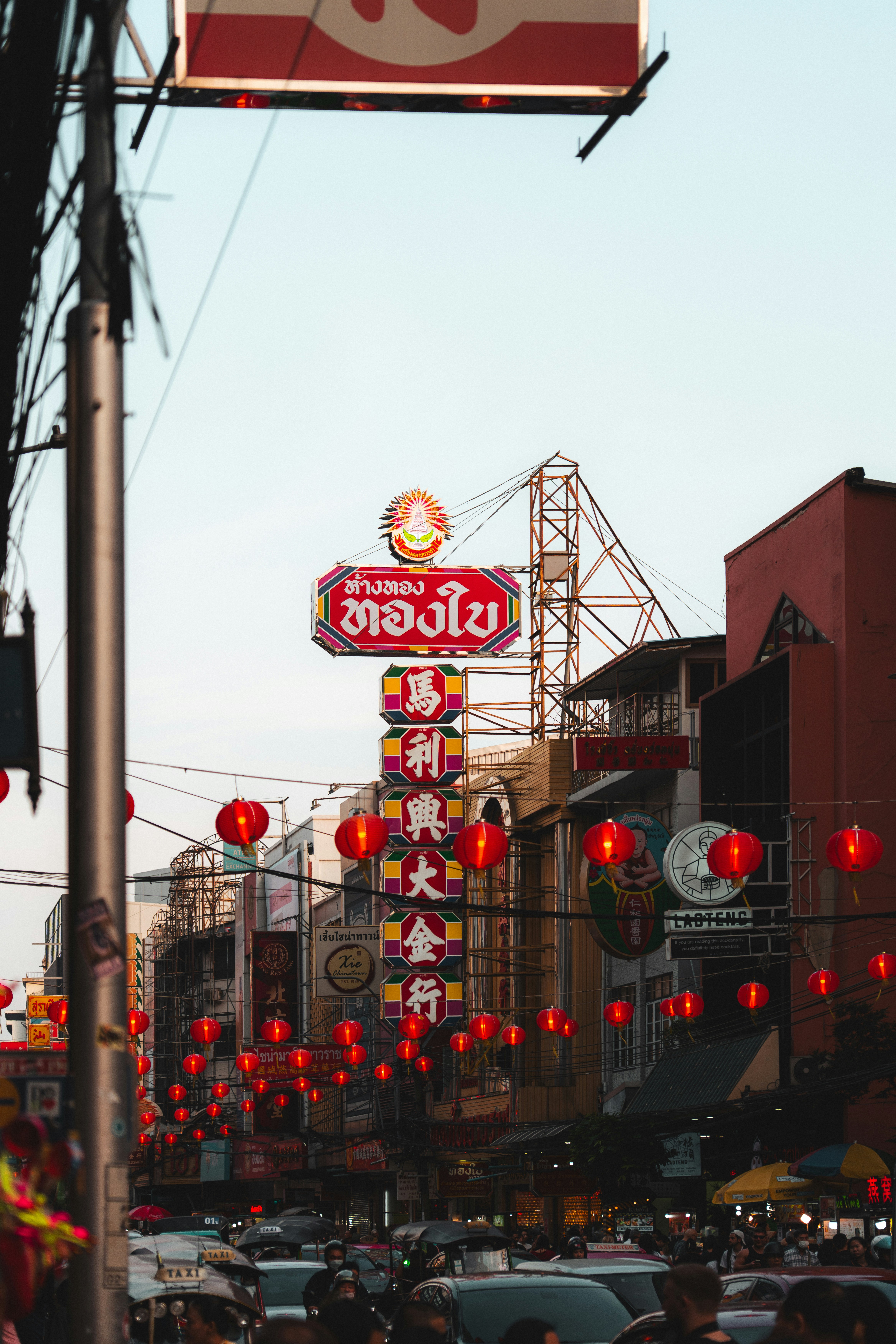 Neon Lanterns Over a Bustling Market Street