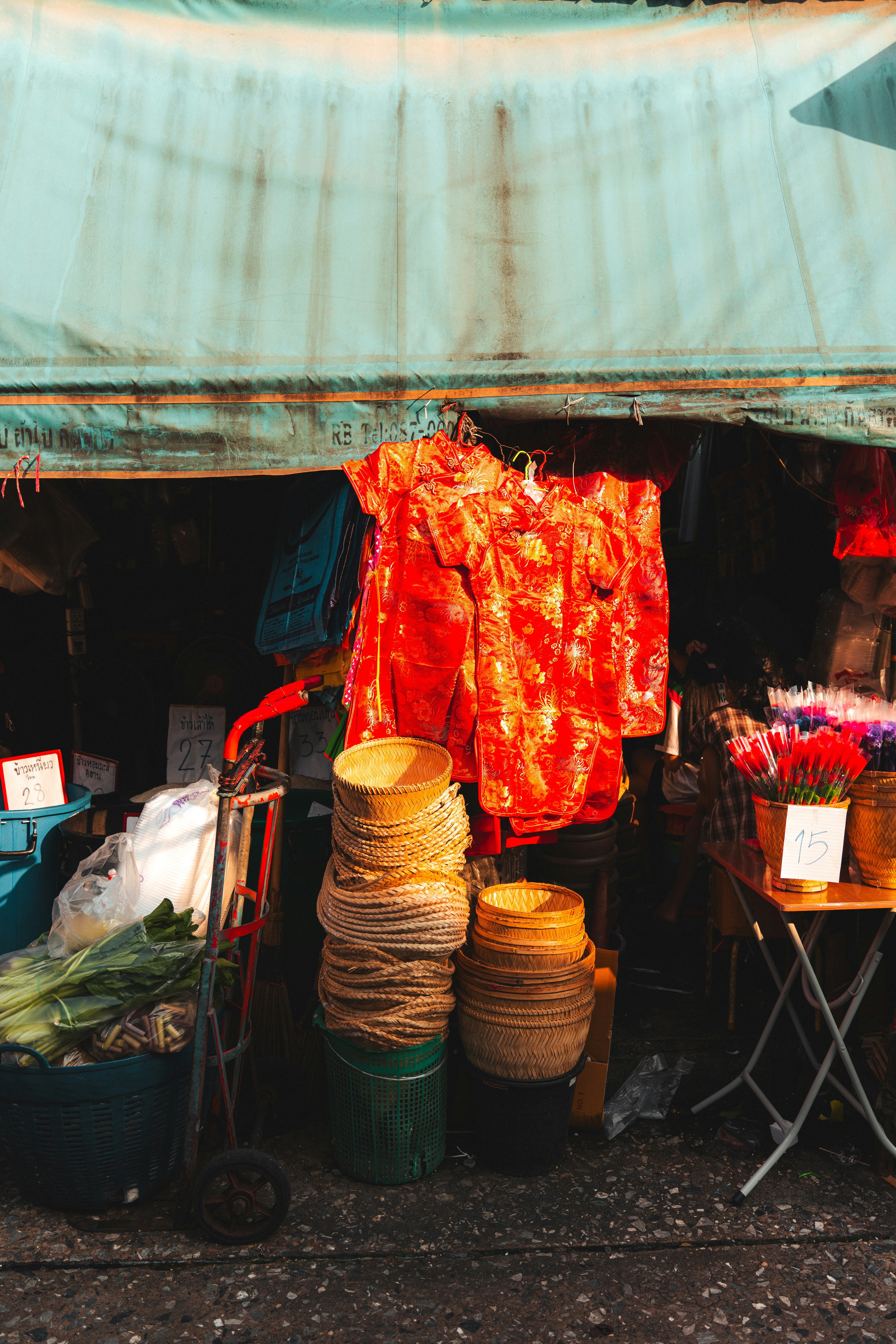 Vibrant Red Garments Crowding a Bustling Market Stall