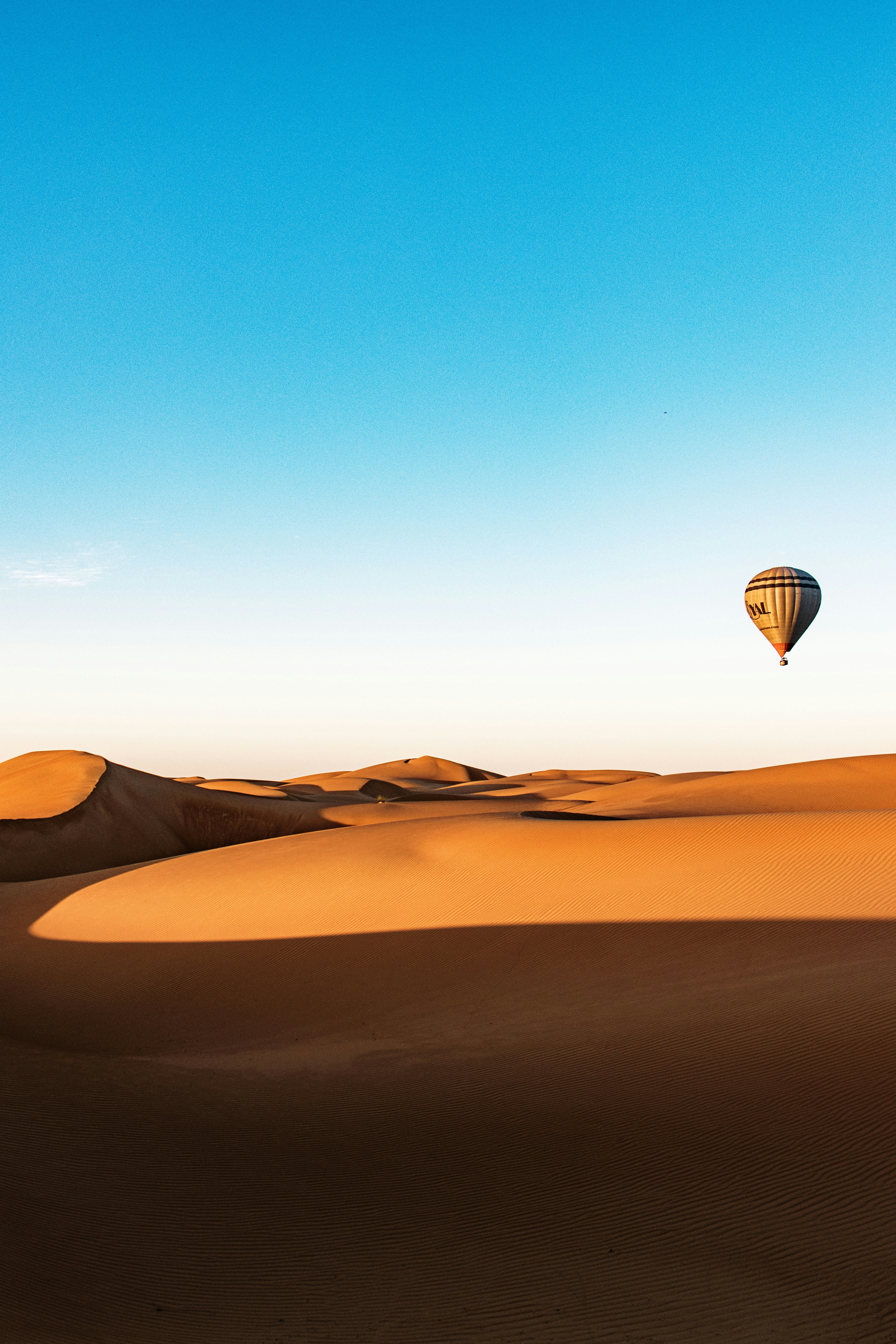 Desert Sky: Hot Air Dawn over Dune Waves