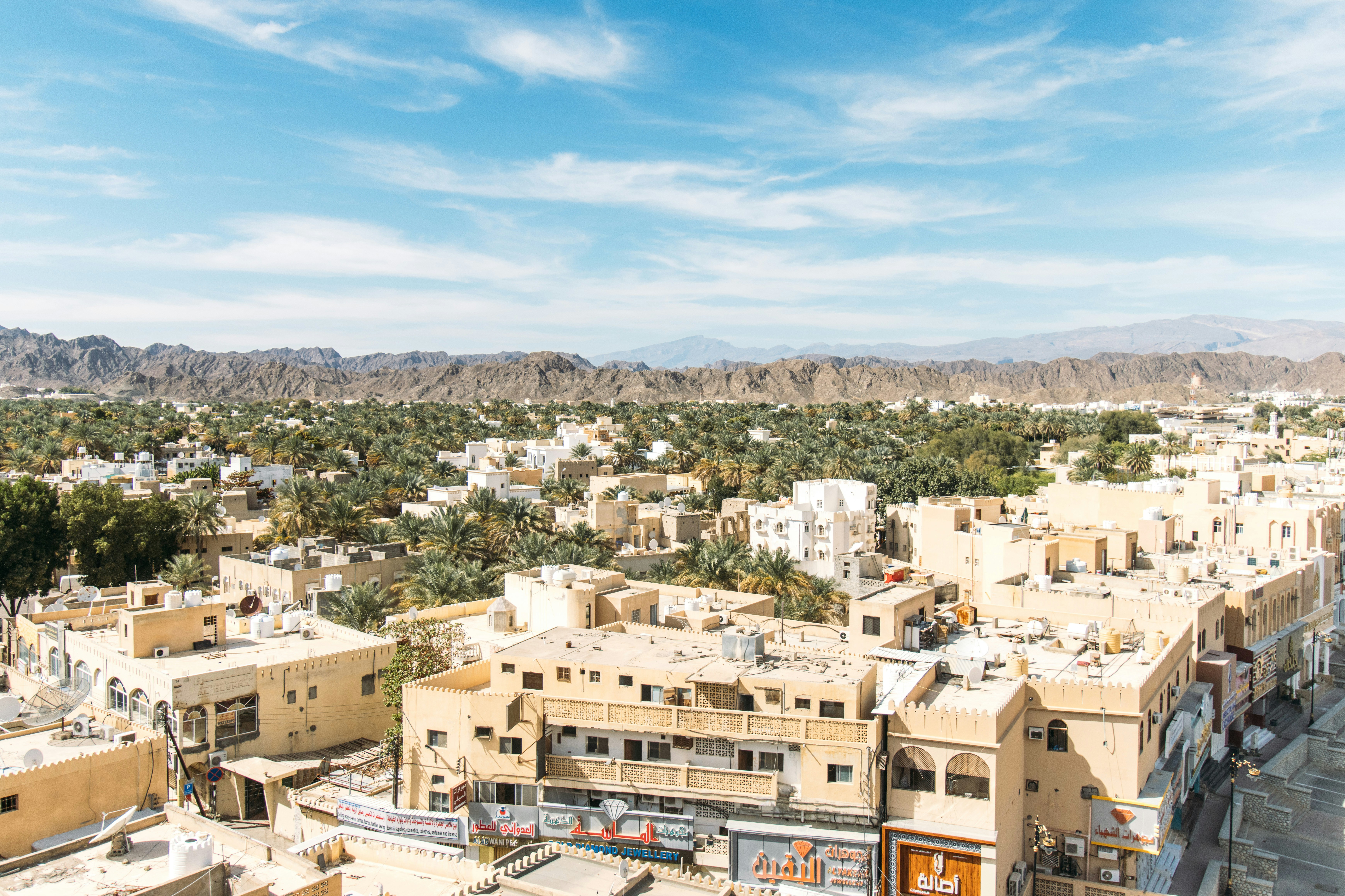 Desert cityscape beneath a clear blue vault