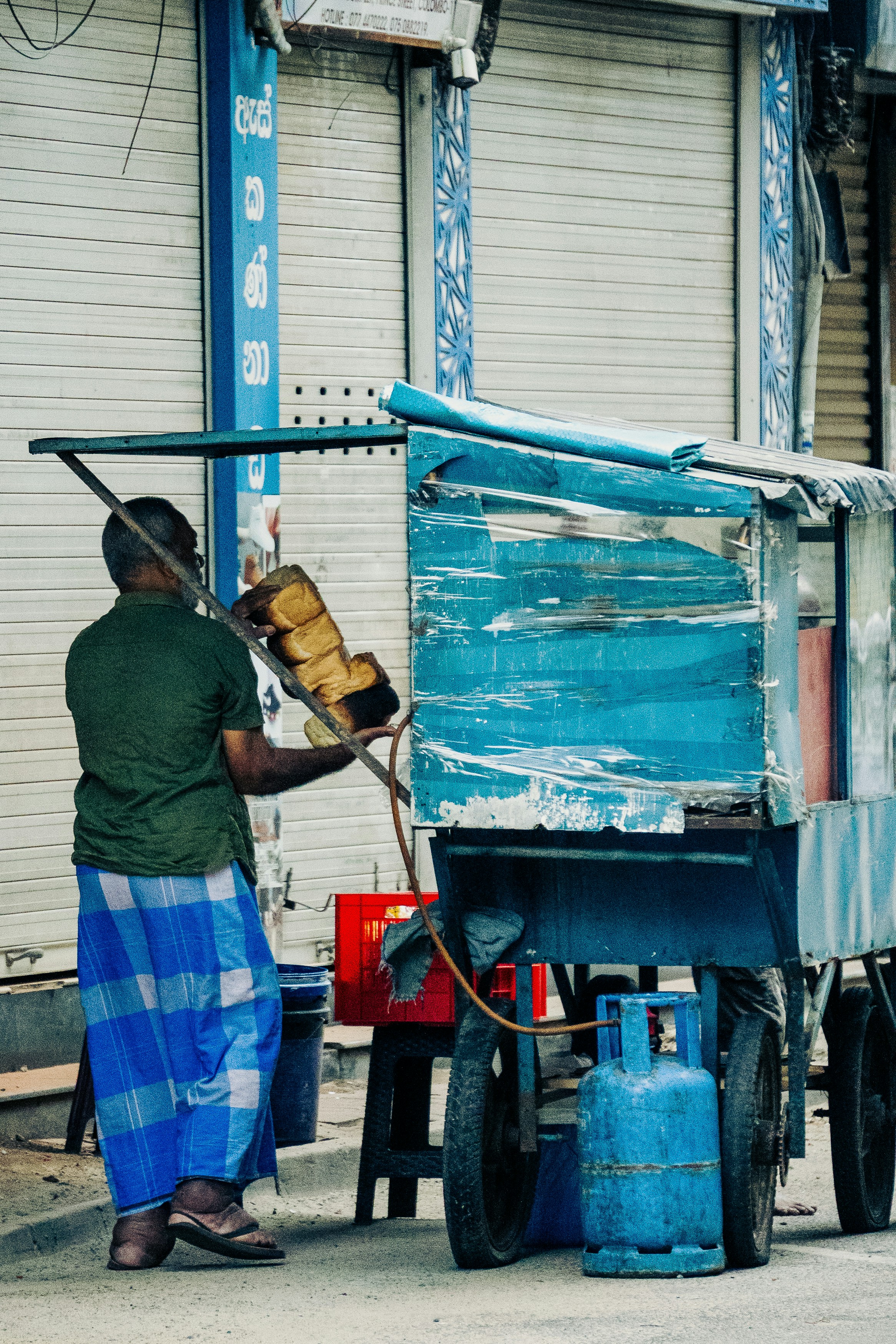 Blue Cart Vendor in a Quiet Street