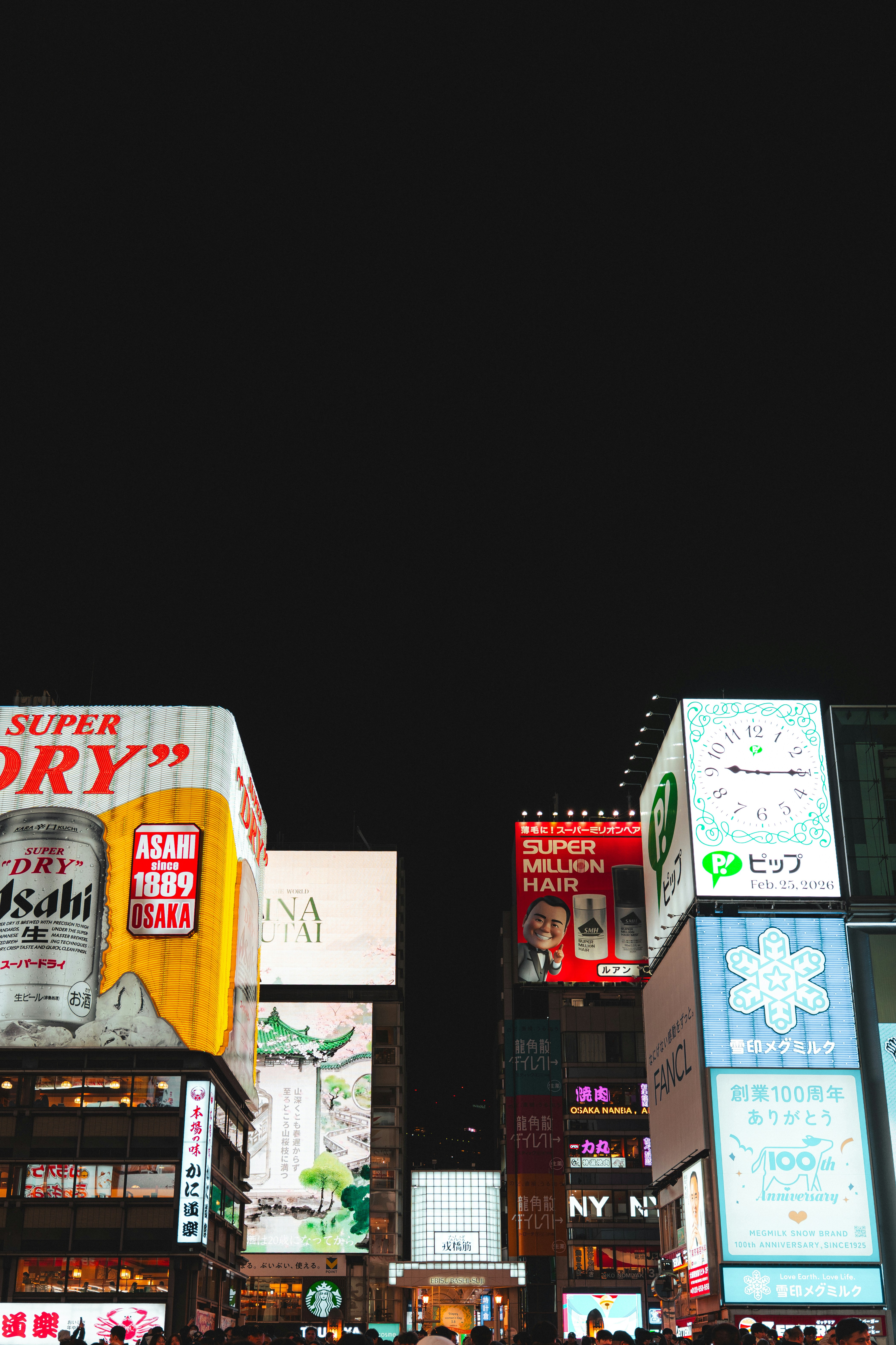 Neon Night Crossing: Tokyo's Bright Billboards Loom Over a Quiet Street