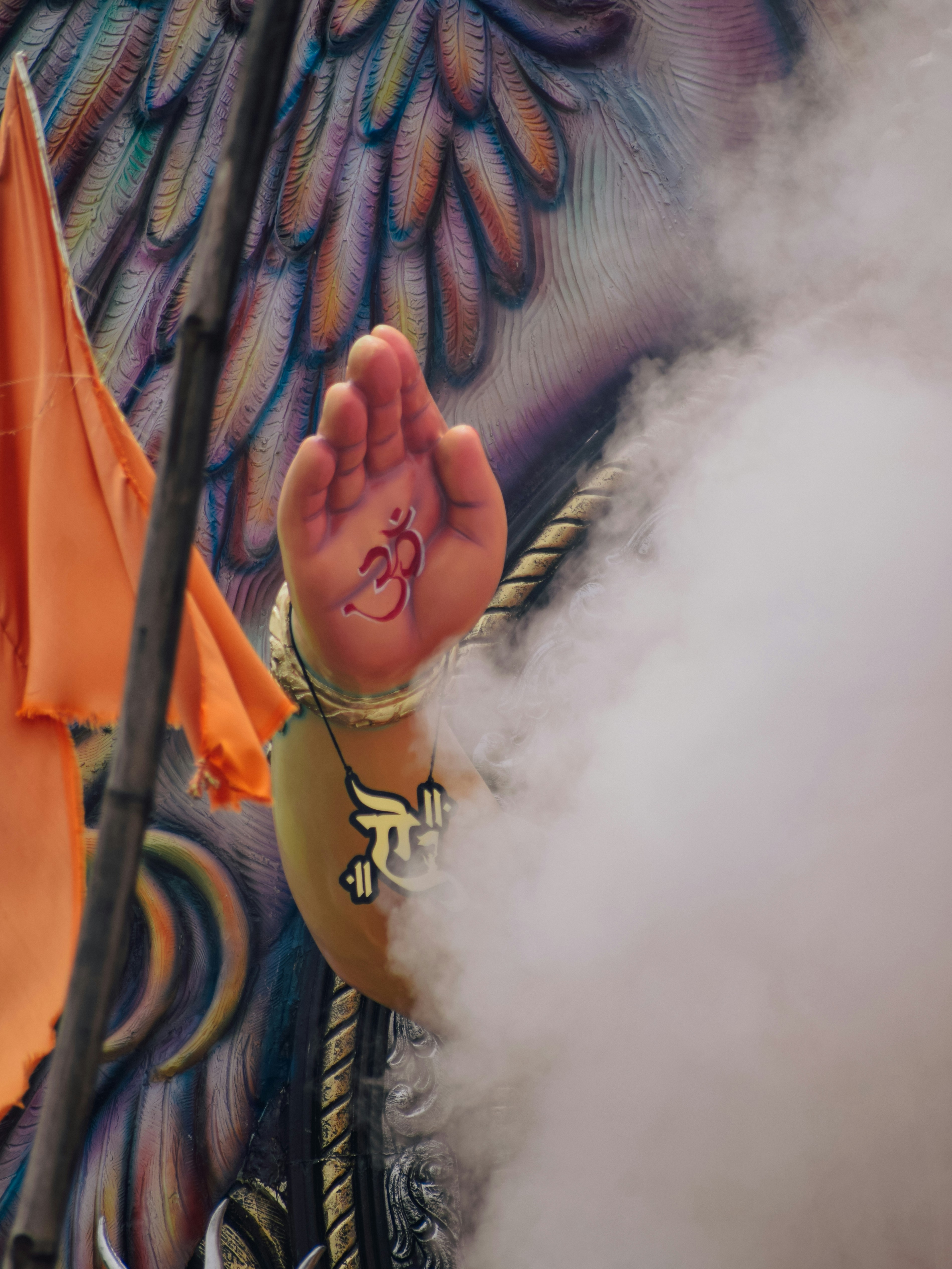 Prayerful Footprint: A Sacred Symbol Amidst Smoke and Color