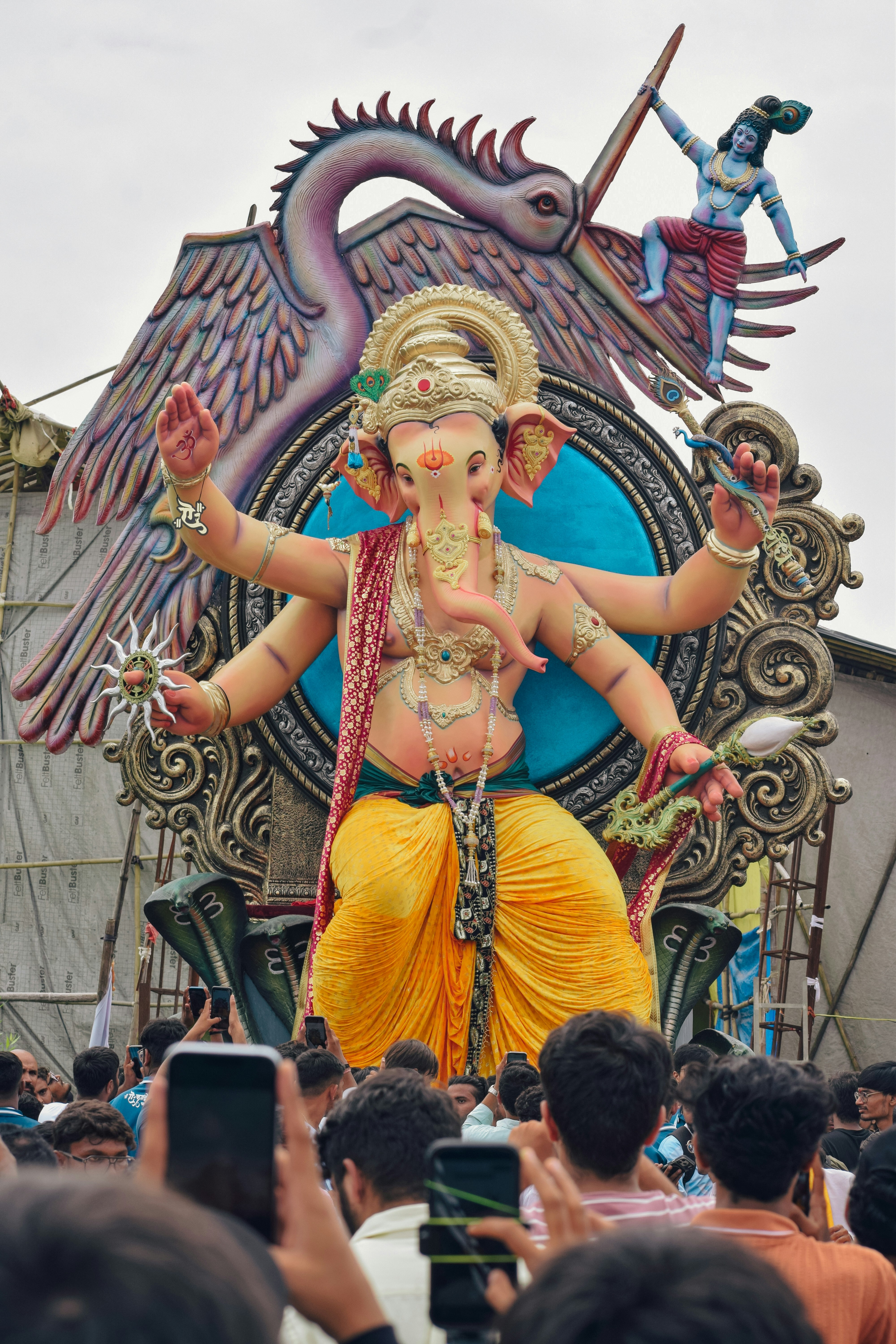 Giant Ganesh Parade Figure Surrounded by Onlookers