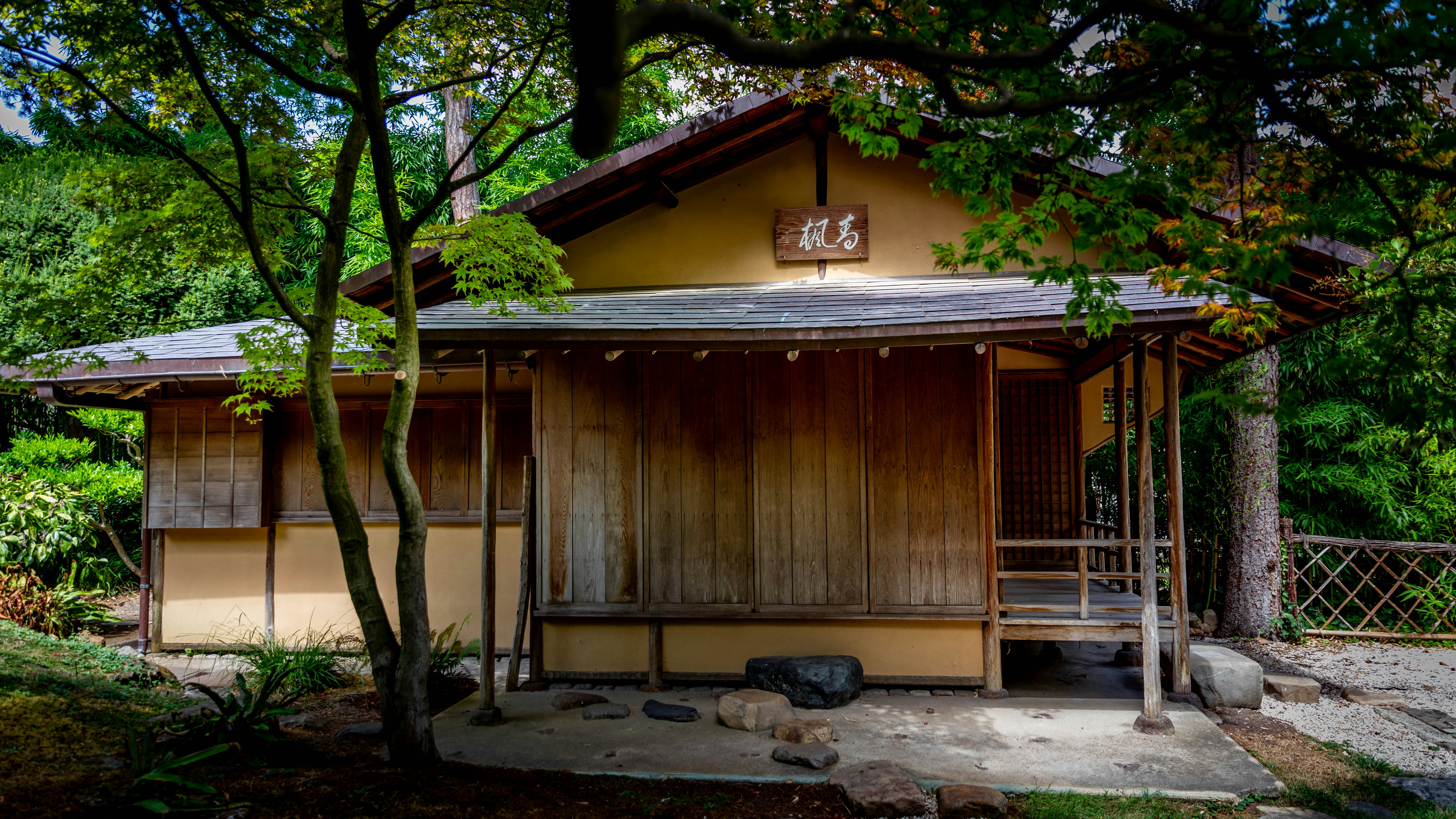 Quiet Teahouse Retreat: A Wooden Shrine Nestled in Greenery