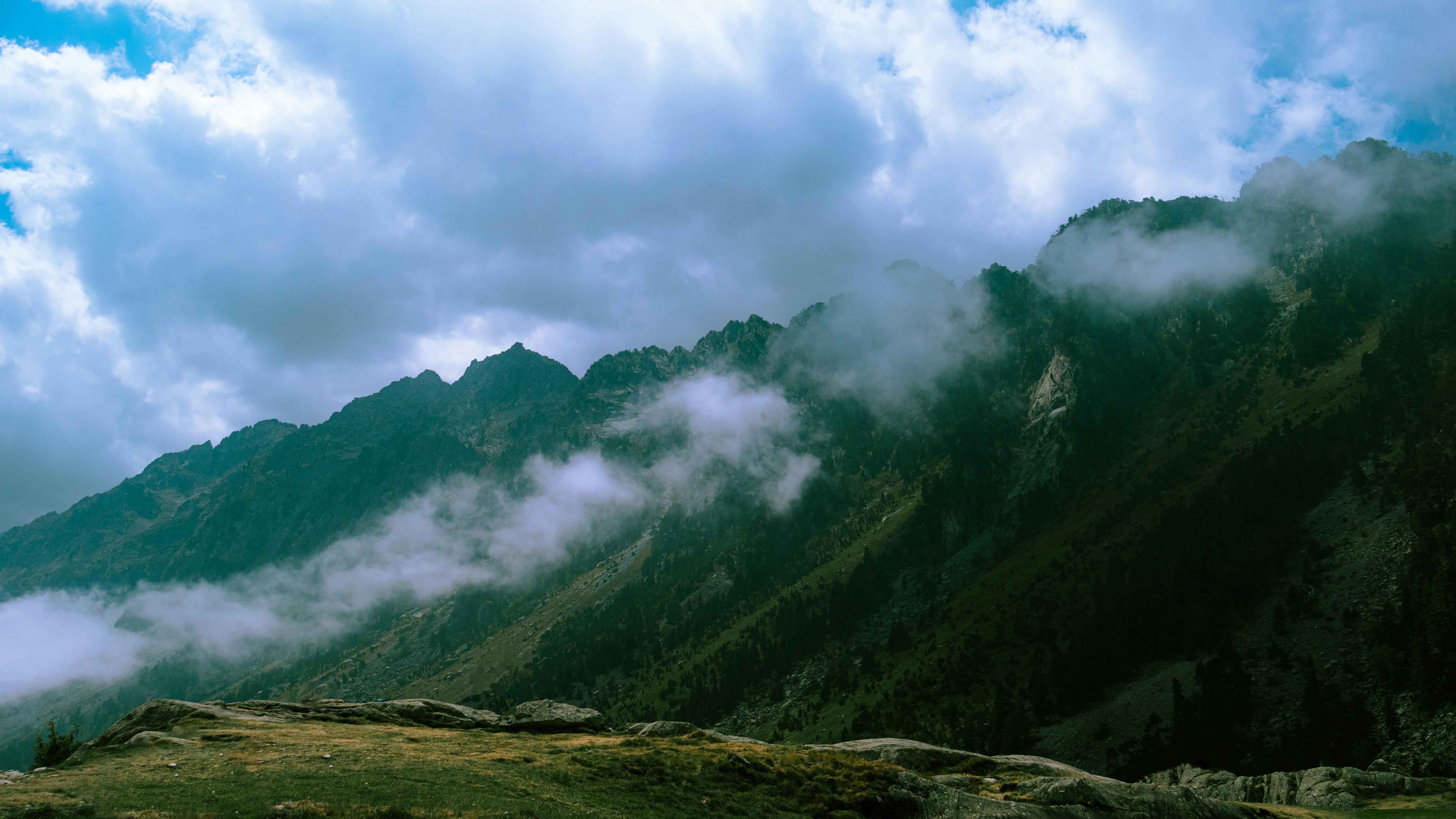 Misty Ridge: Cloud-Touched Peaks Over a Quiet Alpine Terrace