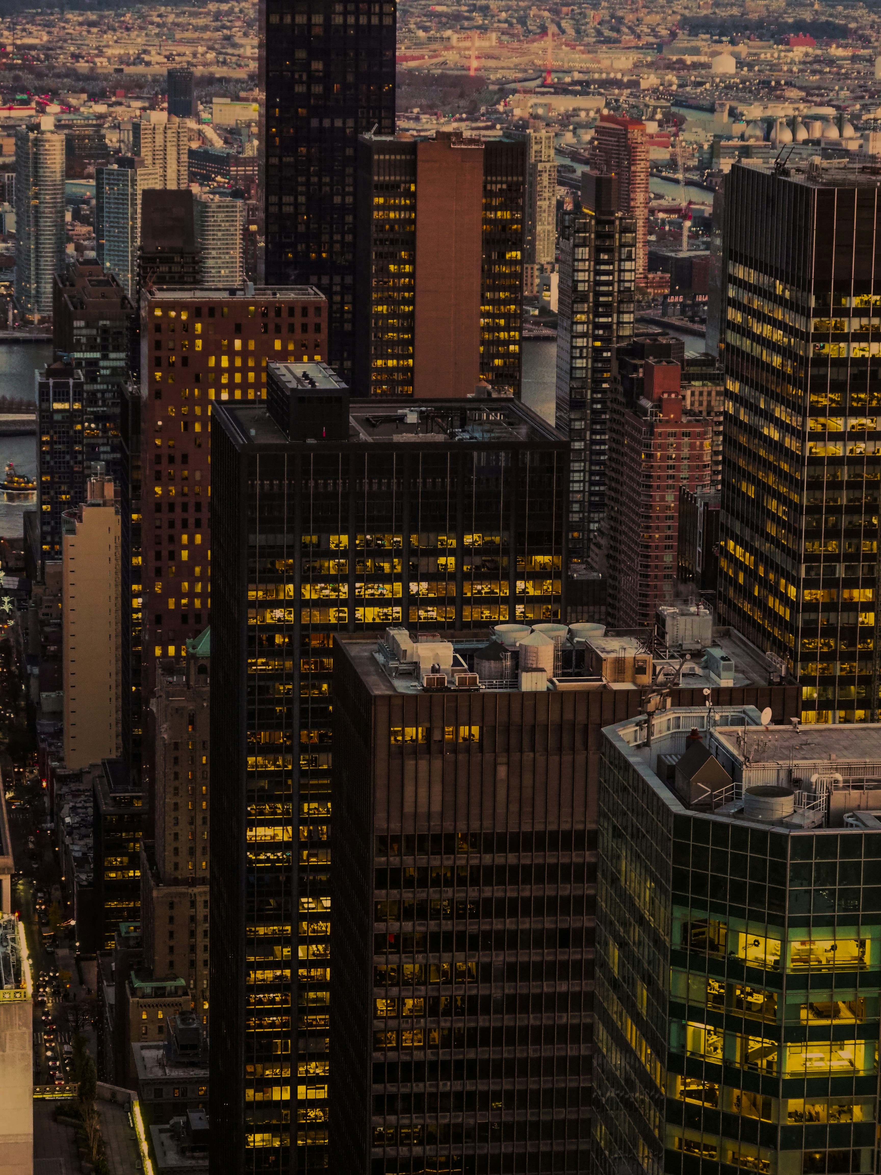 Sunlit Crest: Evening Glow Over Dense Downtown Grid