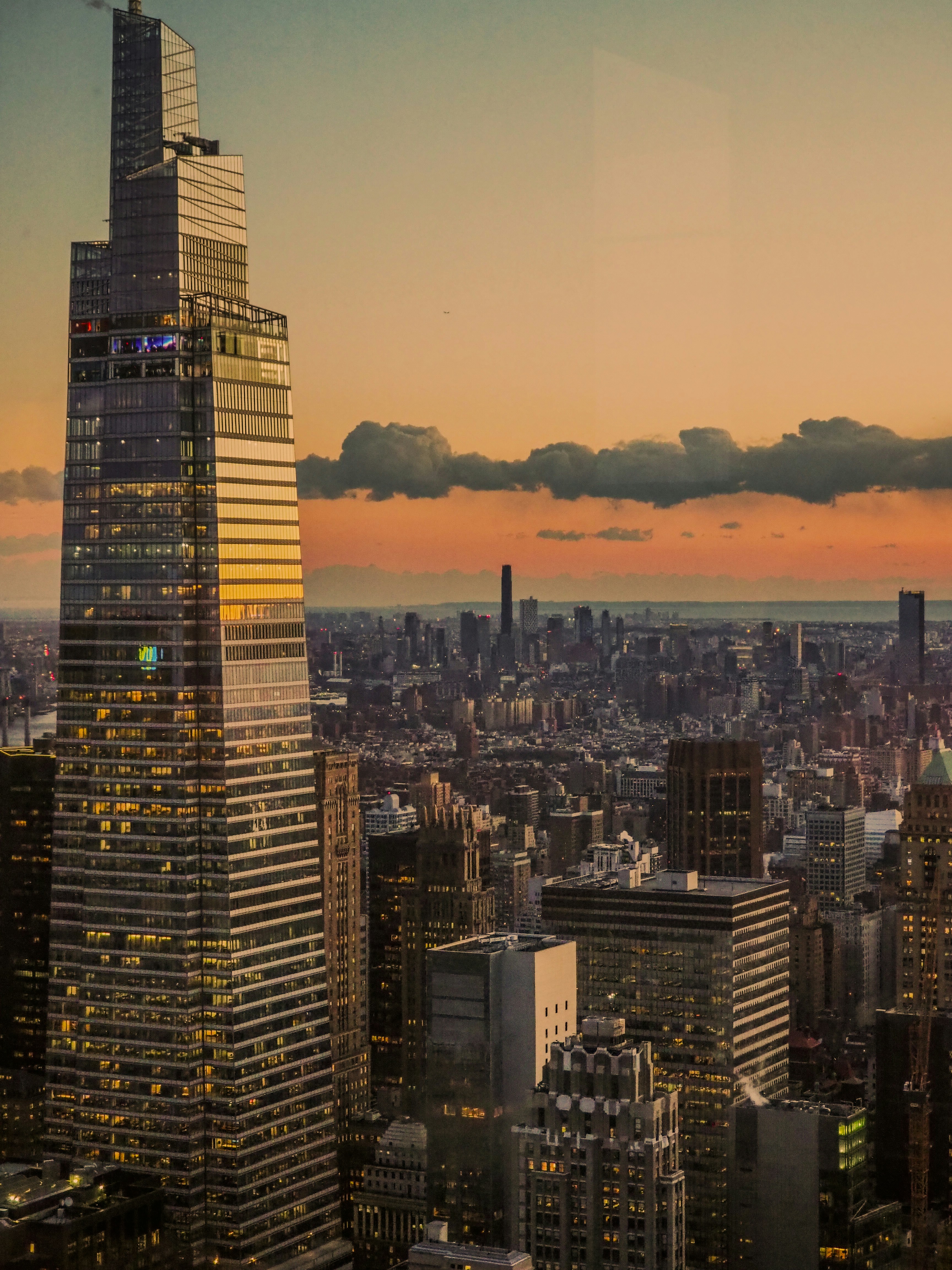 Sunset Over the Spires: A Cityscape Frontlit by Golden Skies