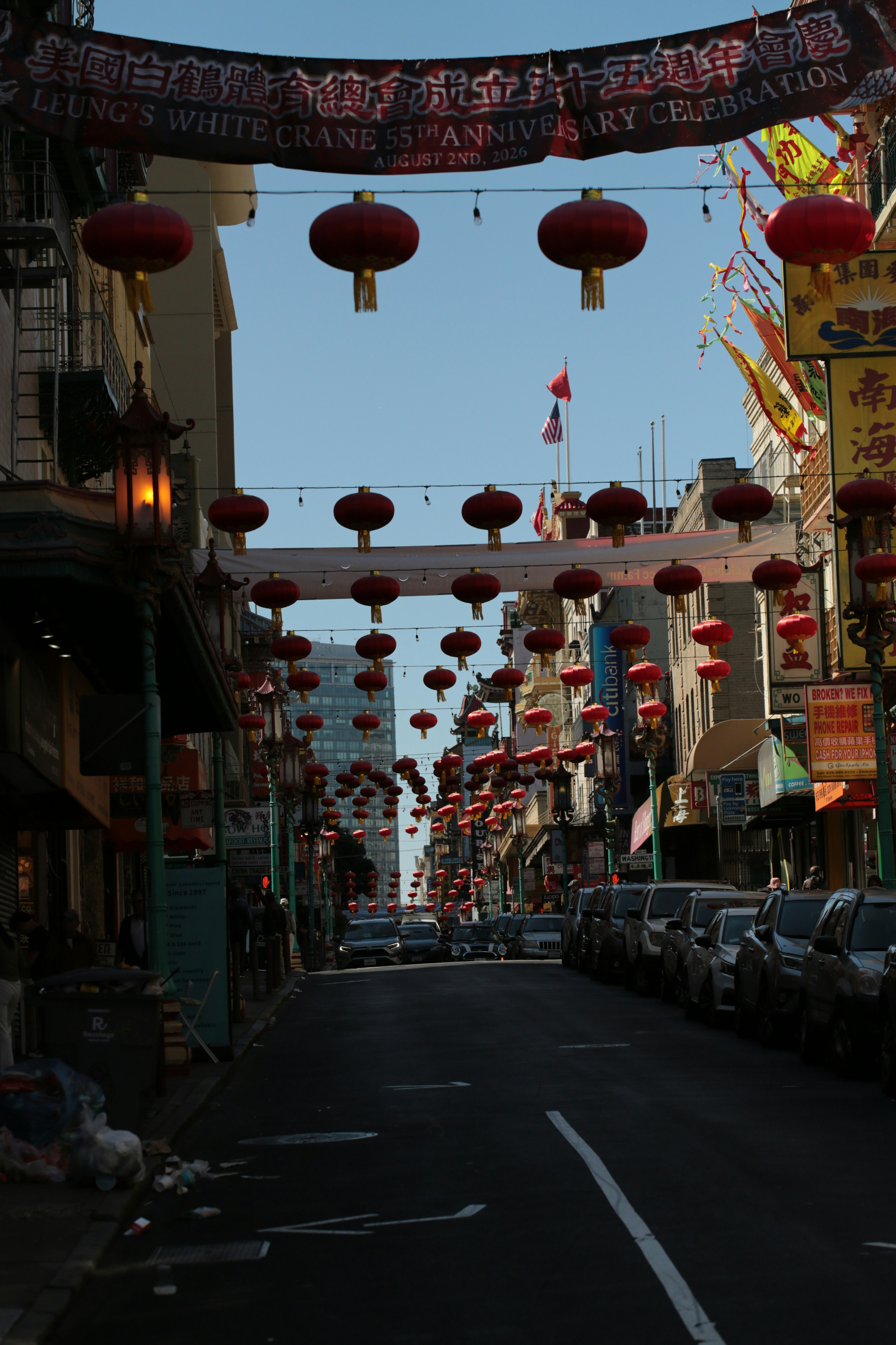 Lantern-lined Chinatown Street Under a Banner of Celebration