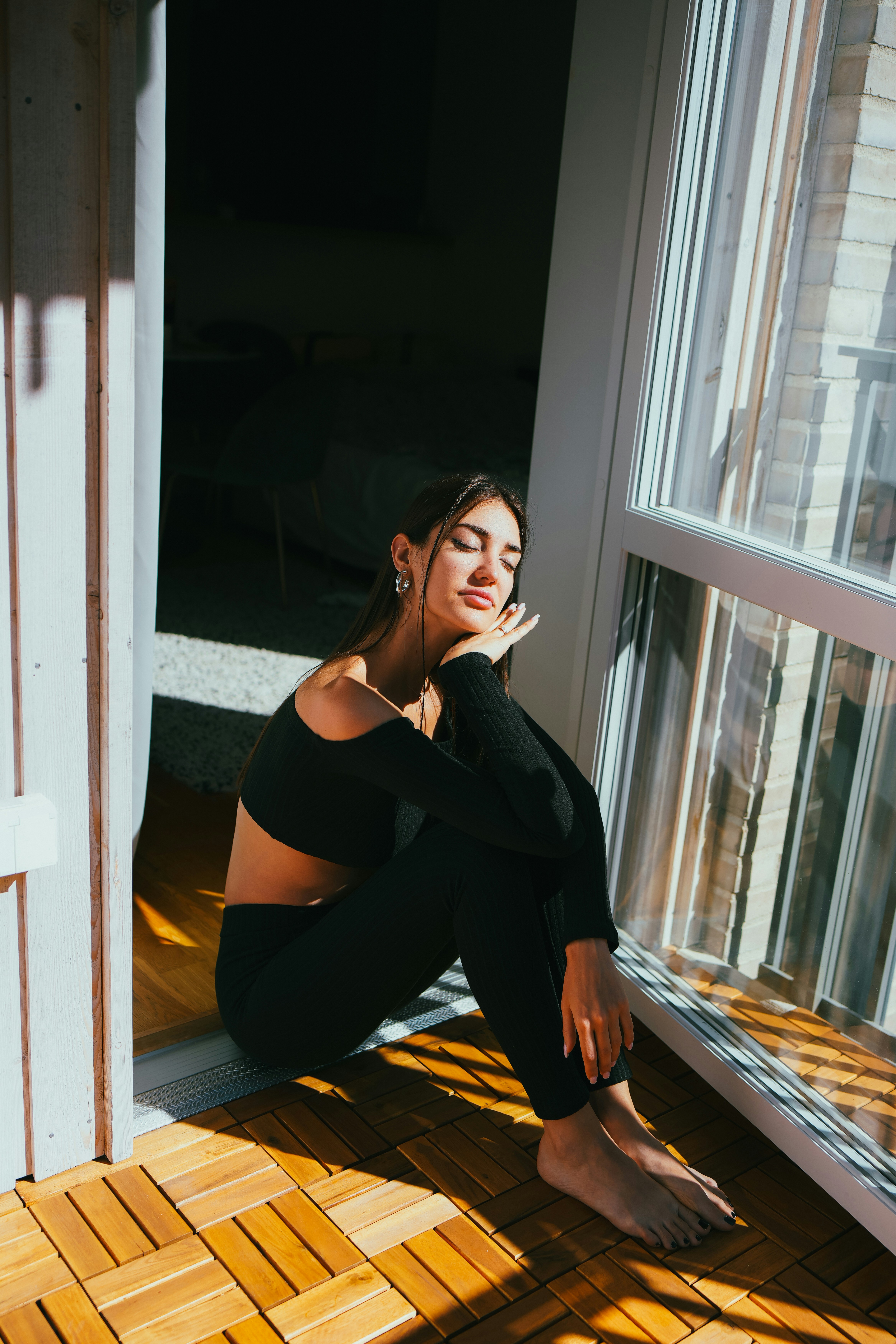 Sunlit Quiet: A Moment of Solace by the Window