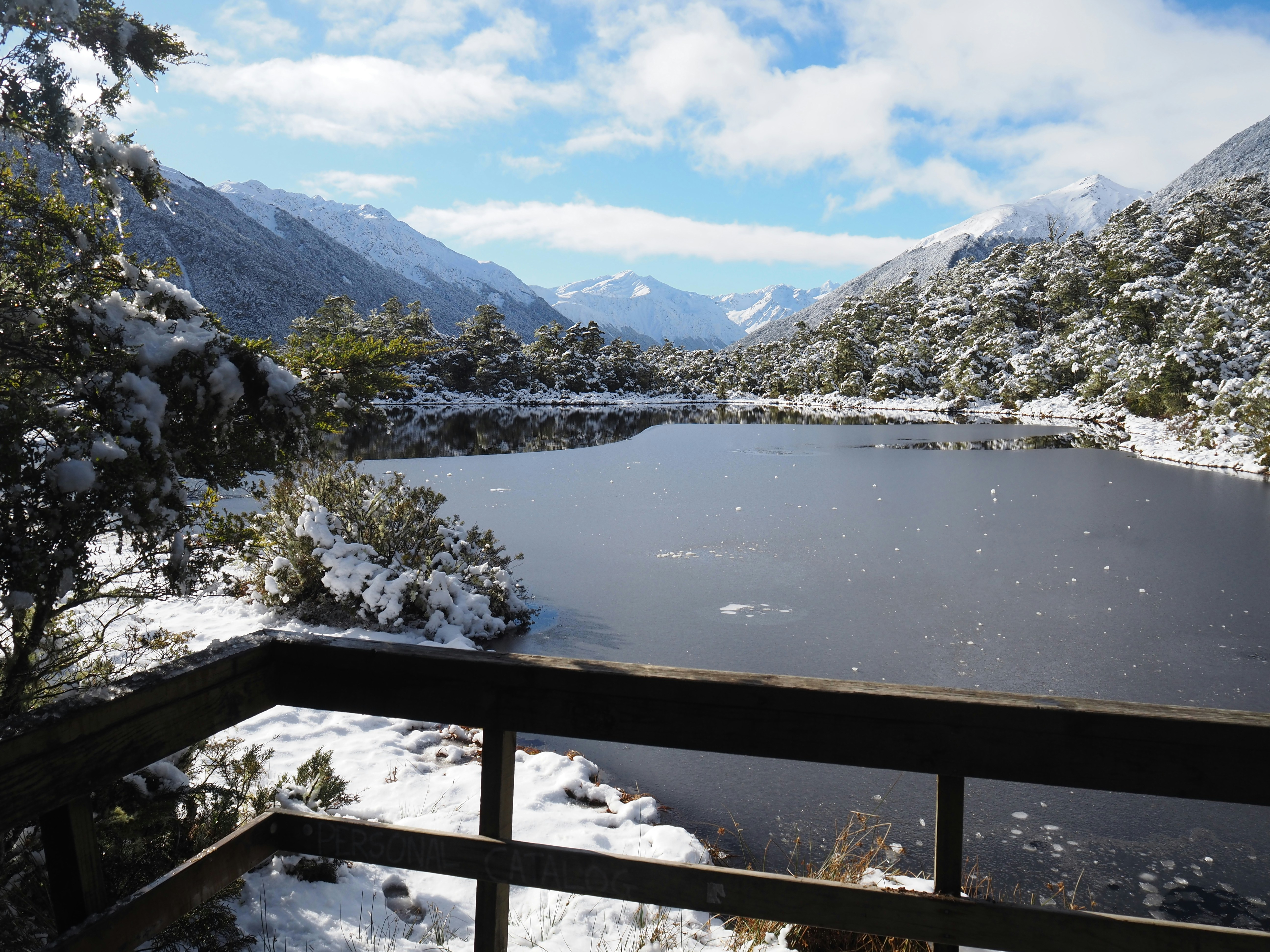Snow-quiet Lake Vista from a Wooden Deck