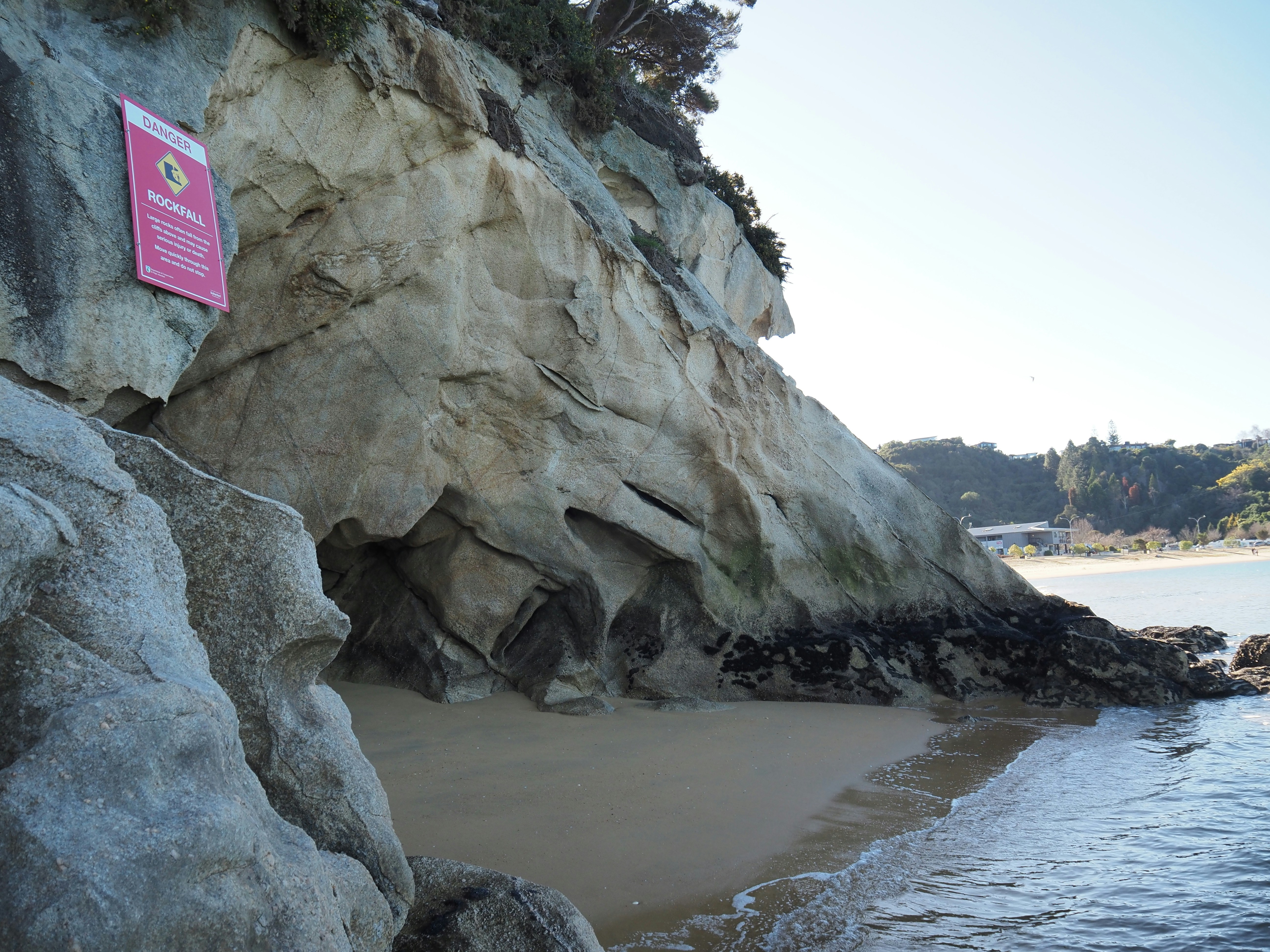 Cliffside Beach Inlet with Weathered Rock Shelter